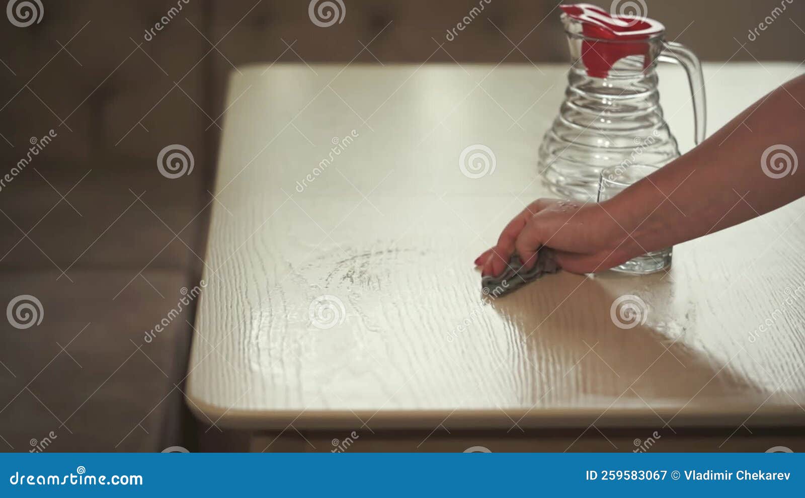 Wipes the table with a rag stock video. Video of room - 259583067