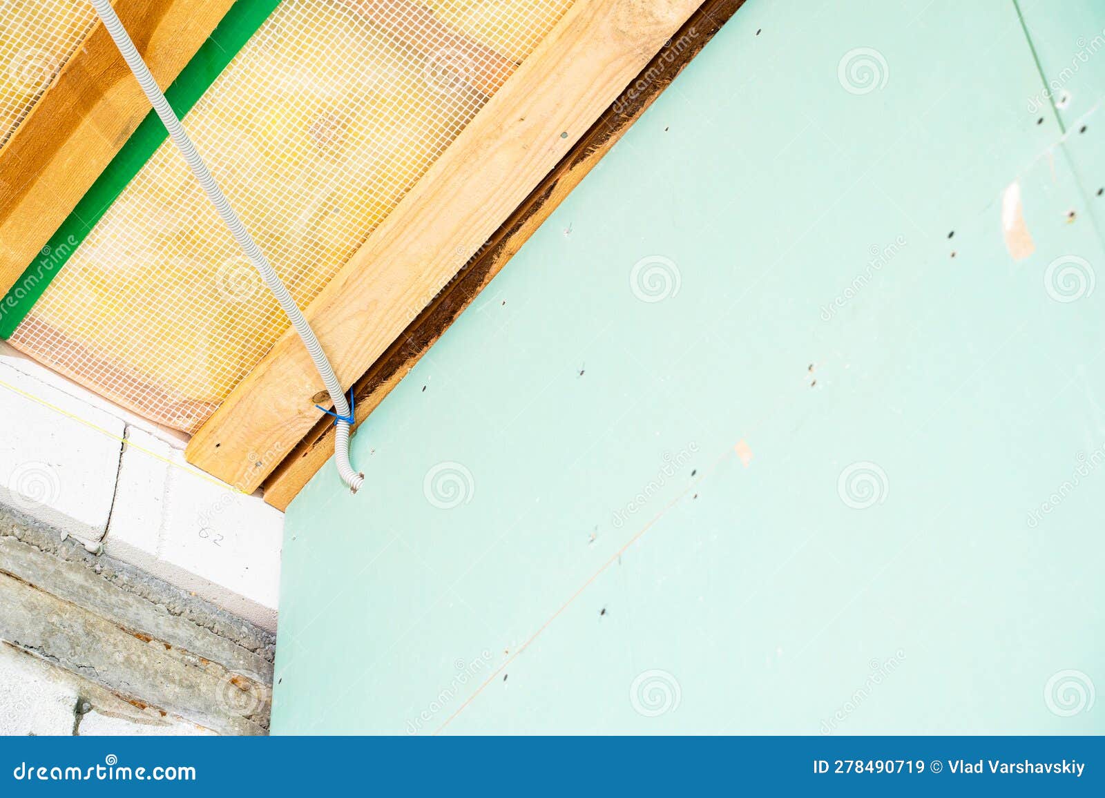 The Wire In The Corrugated Pipe Is Passed Through The Plasterboard ...