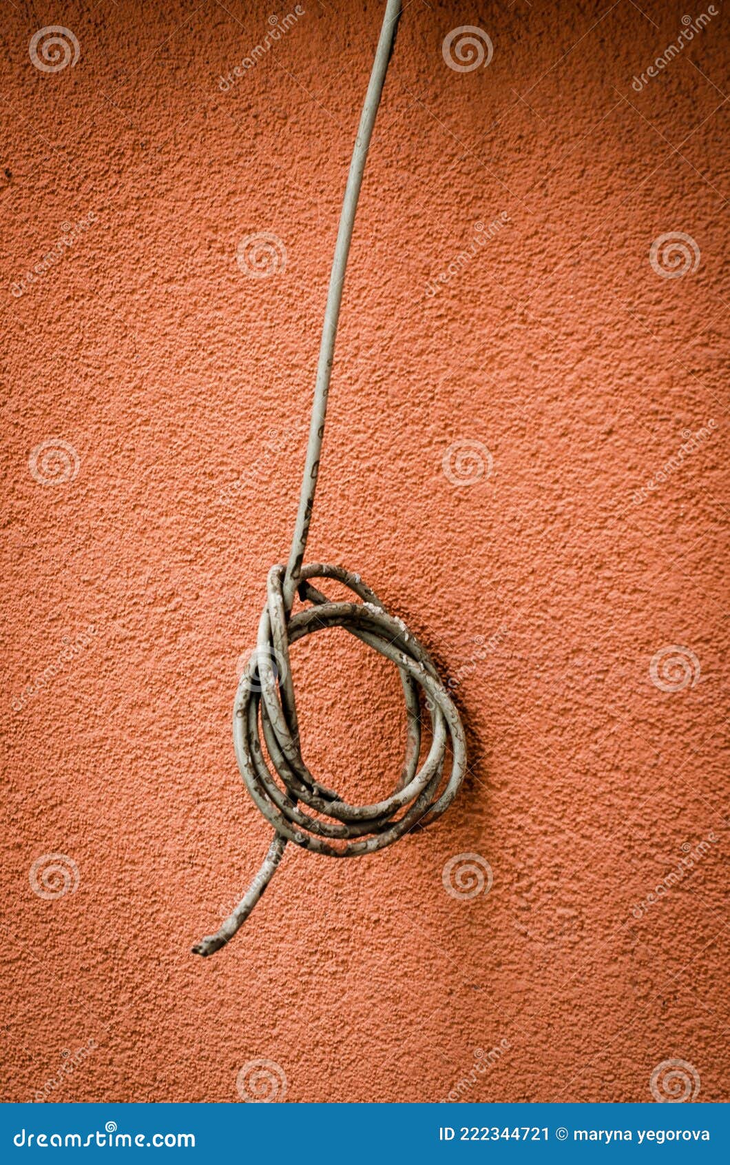 The Wire Loop Hanging on the Orange Textured Background Stock Image ...