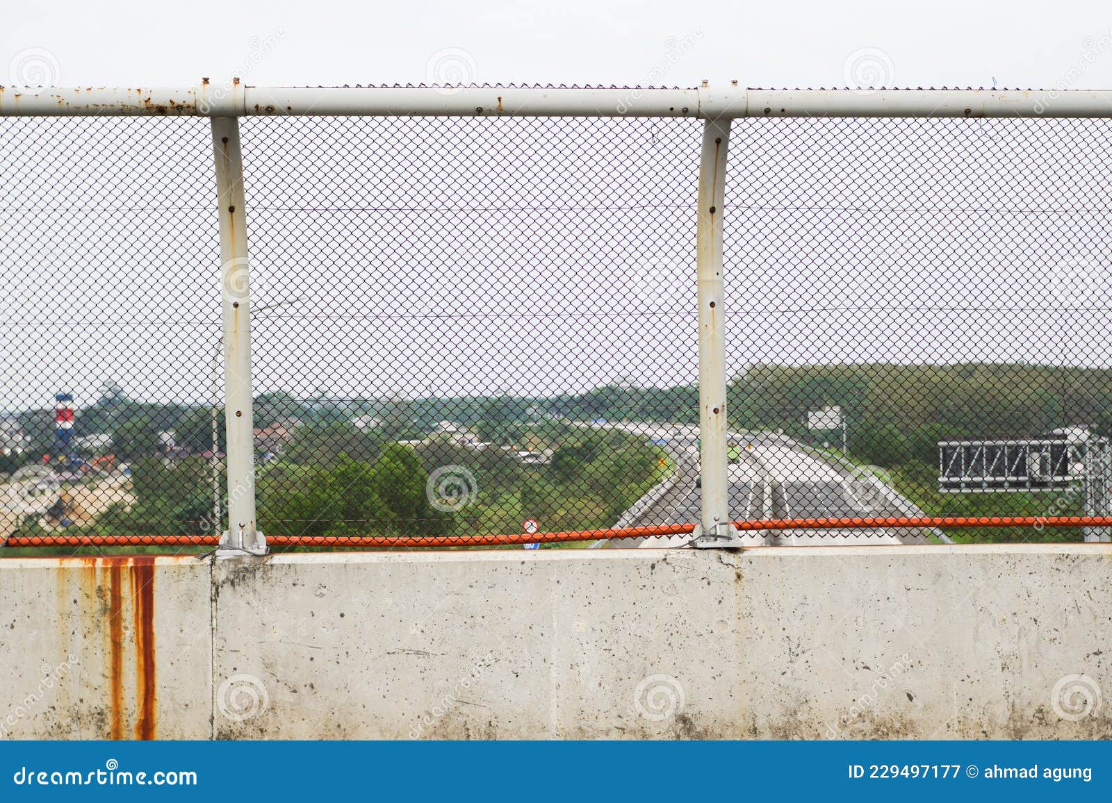 A Wire-mesh Parapet Below Which There is a Highway Stock Image - Image ...