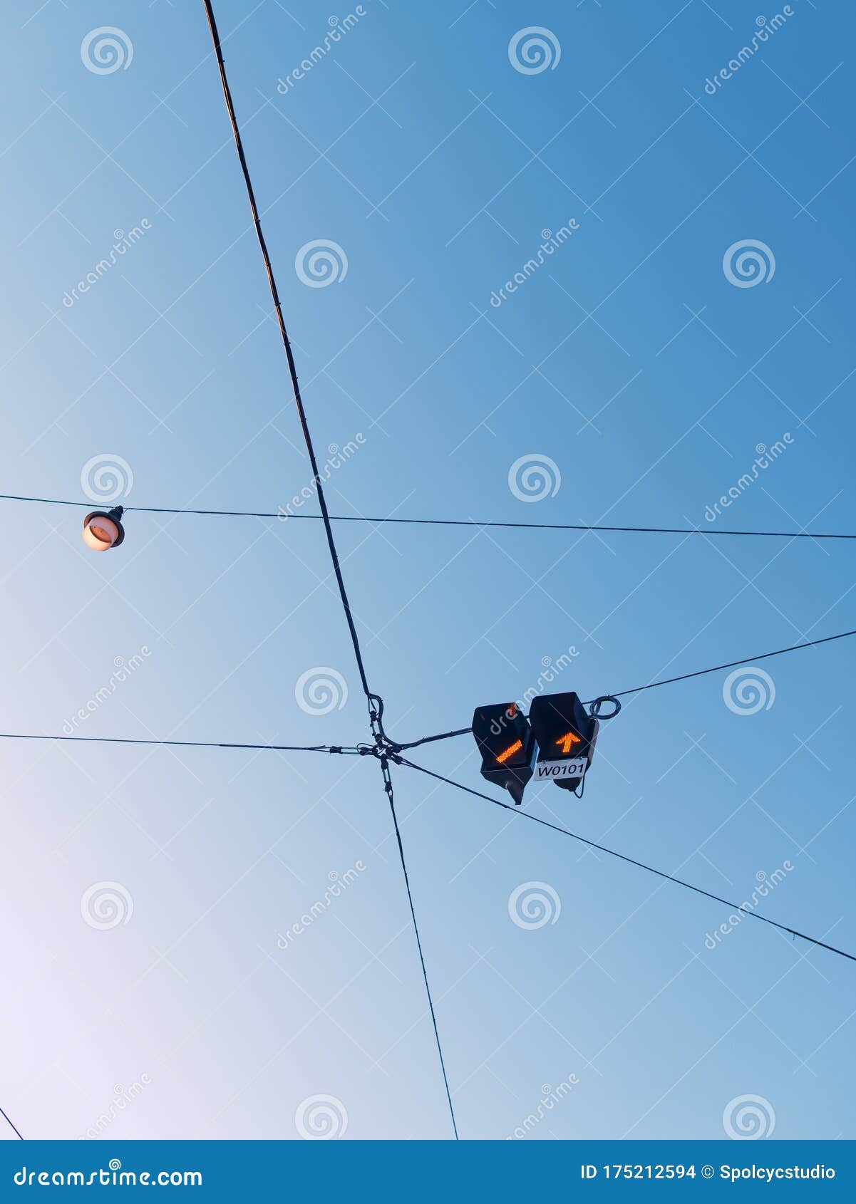 Wire-mounted Traffic Light Against Blue Sky. Stock Photo - Image of ...