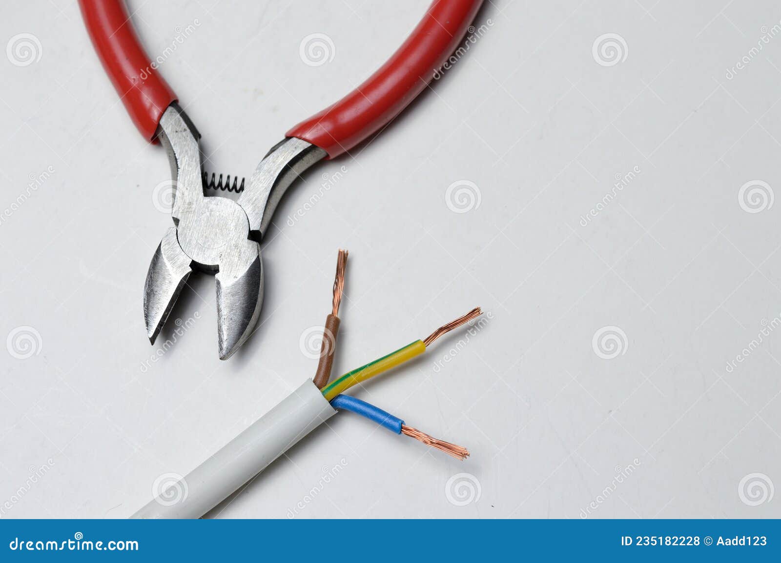 Wire Stripper, Shielded Three-core Wire and Wire Cutters on a White ...