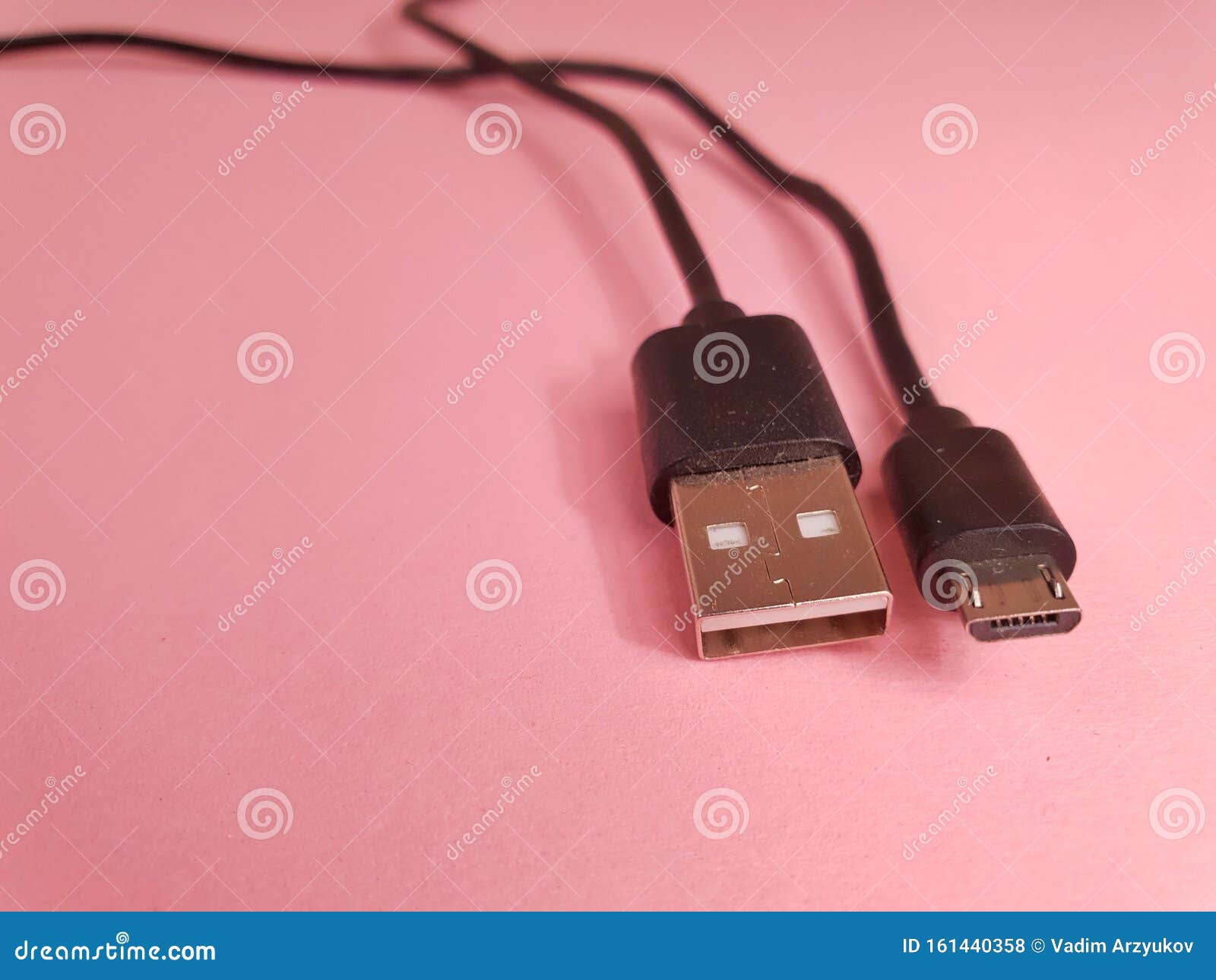 Wire with USB Connector and Micro Usb Closeup on Pink Background Stock ...