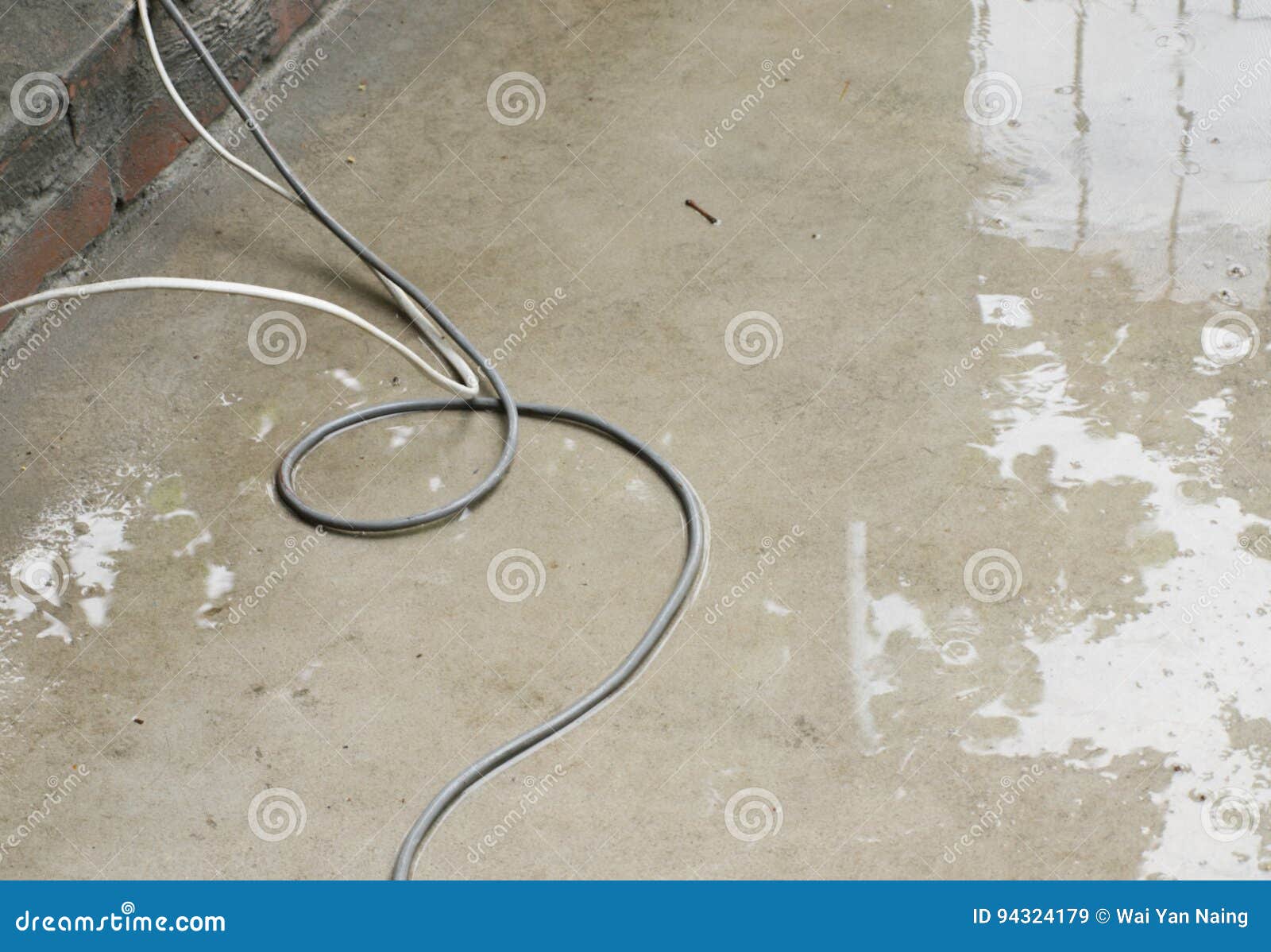 WIRE on WET CONCRETE GROUND Stock Image - Image of line, risk: 94324179