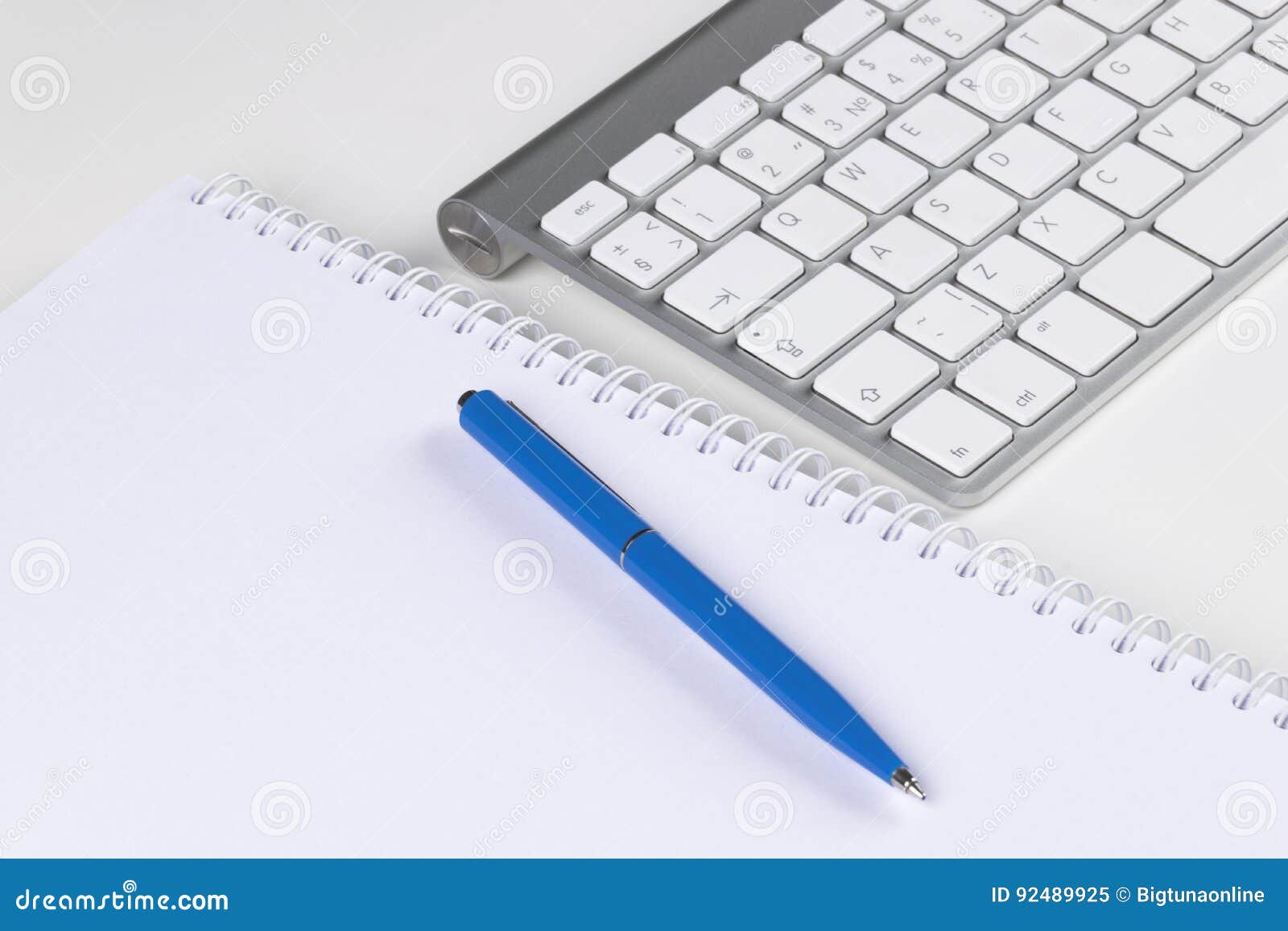 Wireless Computer Keyboard, Notebook and Pen on Business Office Table ...