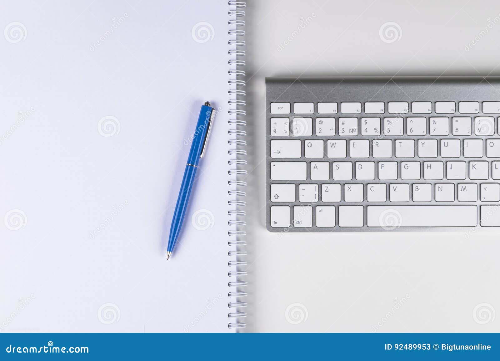 Wireless Computer Keyboard, Notebook and Pen on Business Office Table ...