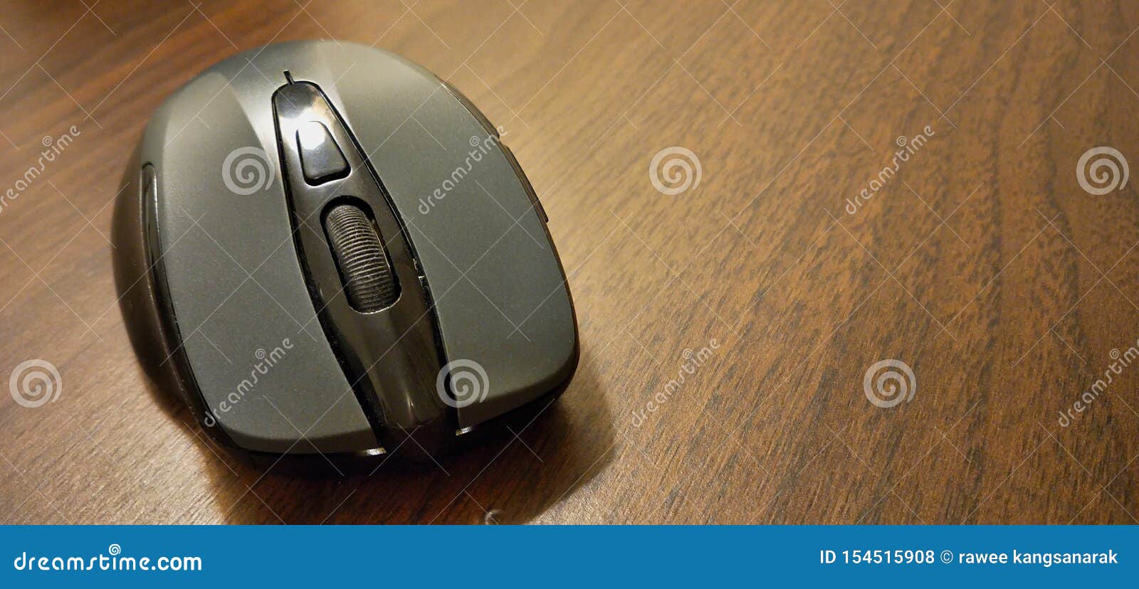 A Wireless Computer Mouse with Wood Surface Table Stock Photo - Image ...