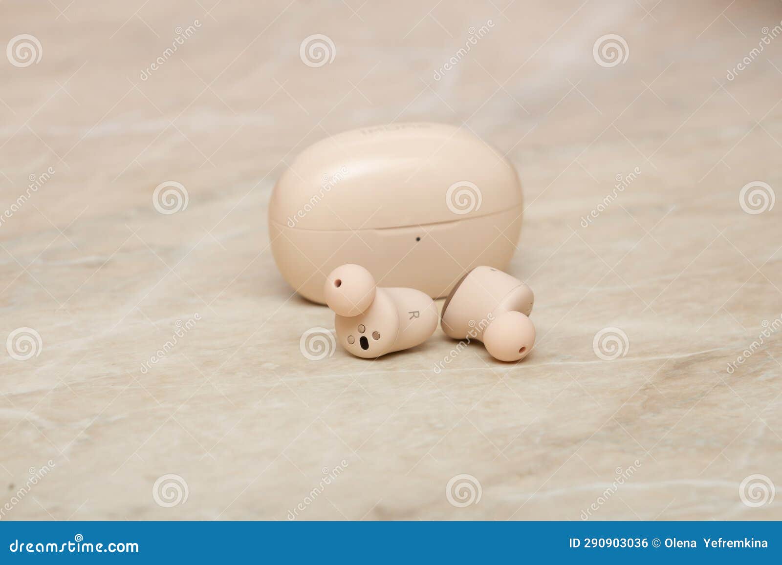 Wireless Earbuds in-ear with Charging Box on the Table Close-up. Stock ...