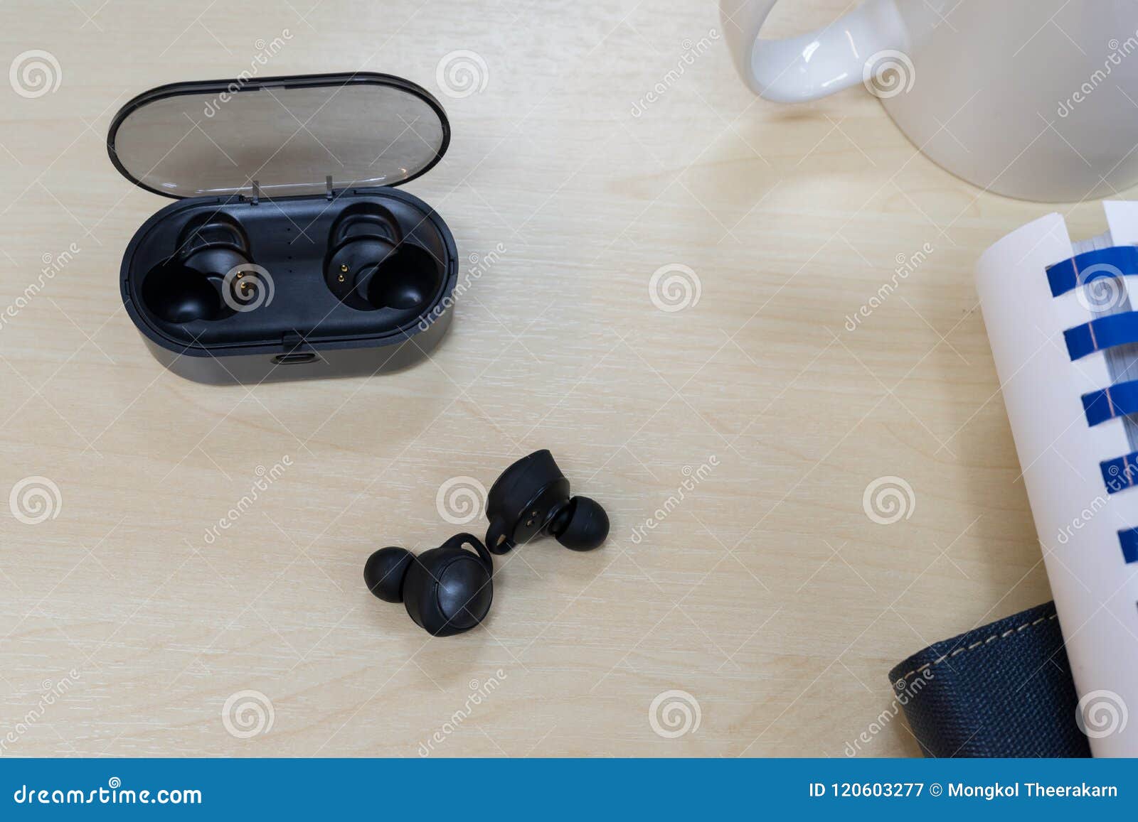 Wireless Earbuds and Charger on Table in Office Stock Image - Image of ...