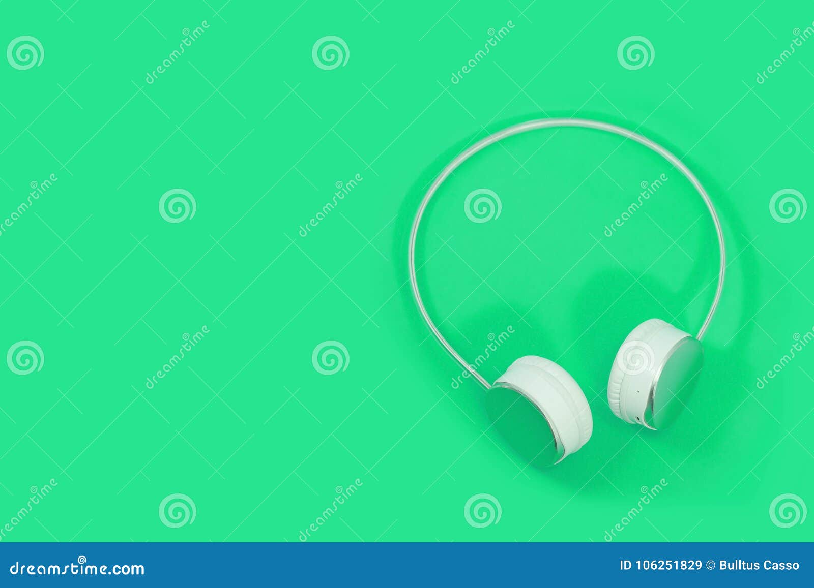 Wireless Headphones Isolated on Light Green Background. Bluetooth Stock ...