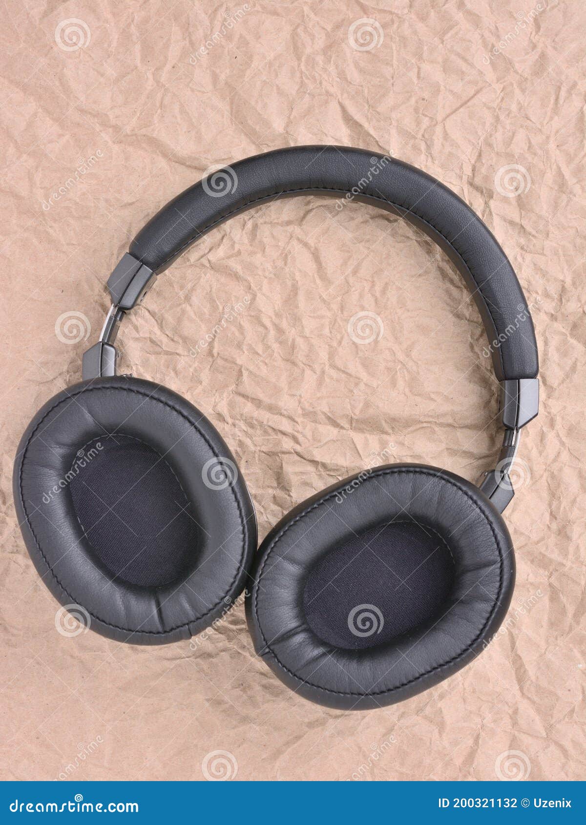 Wireless Headsets Close-up on a Background of Craft Paper Stock Photo ...