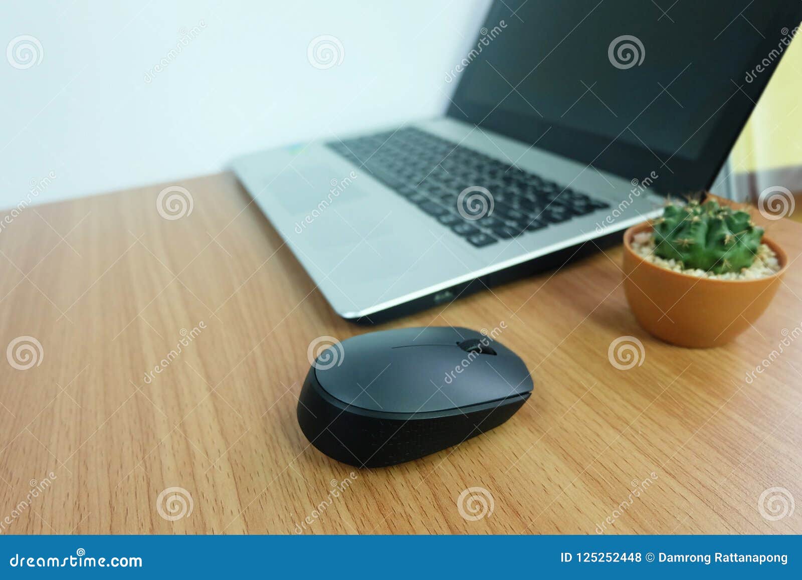 Wireless Mouse with Laptop or Notebook Computer on the Desk Wooden ...