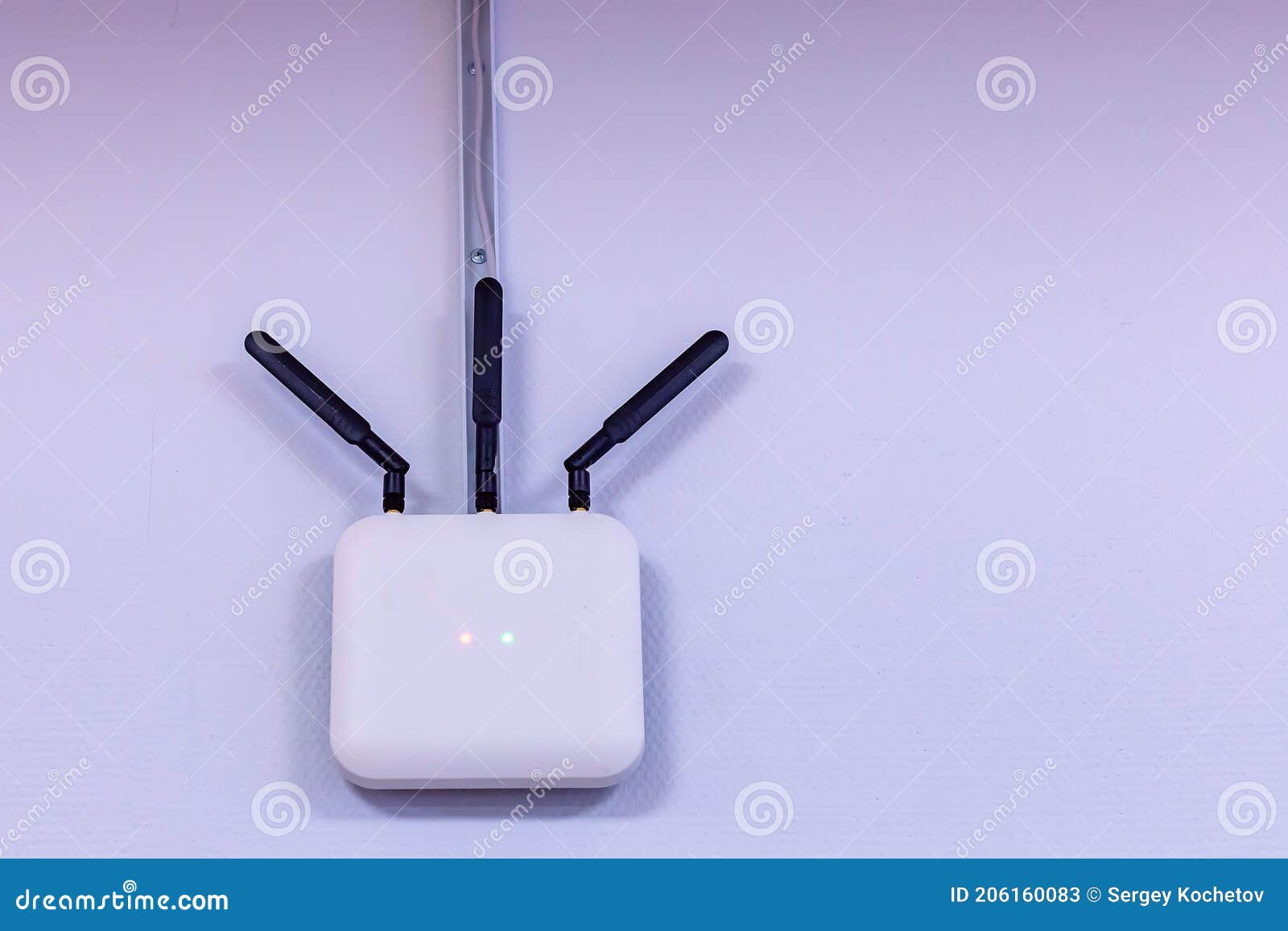 Wireless Router for the Network Hanging on the White Wall. World ...