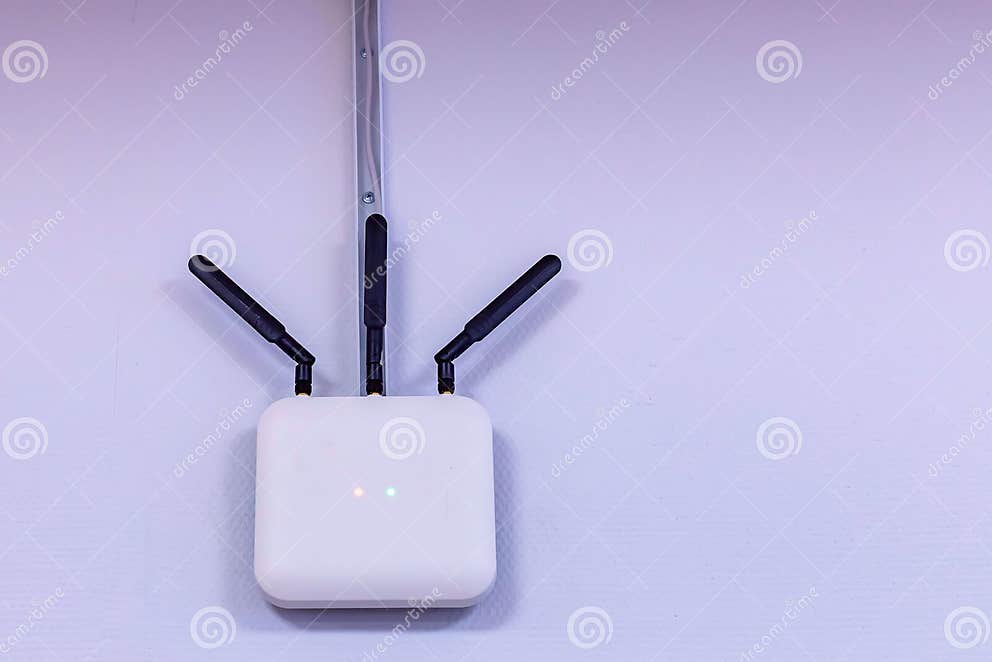 Wireless Router for the Network Hanging on the White Wall. World ...