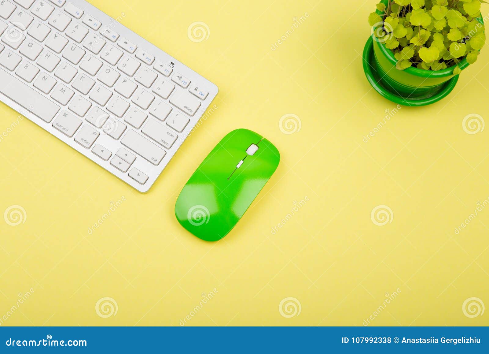 Wireless Slim White Keyboard and Green Mouse on Yellow Background ...