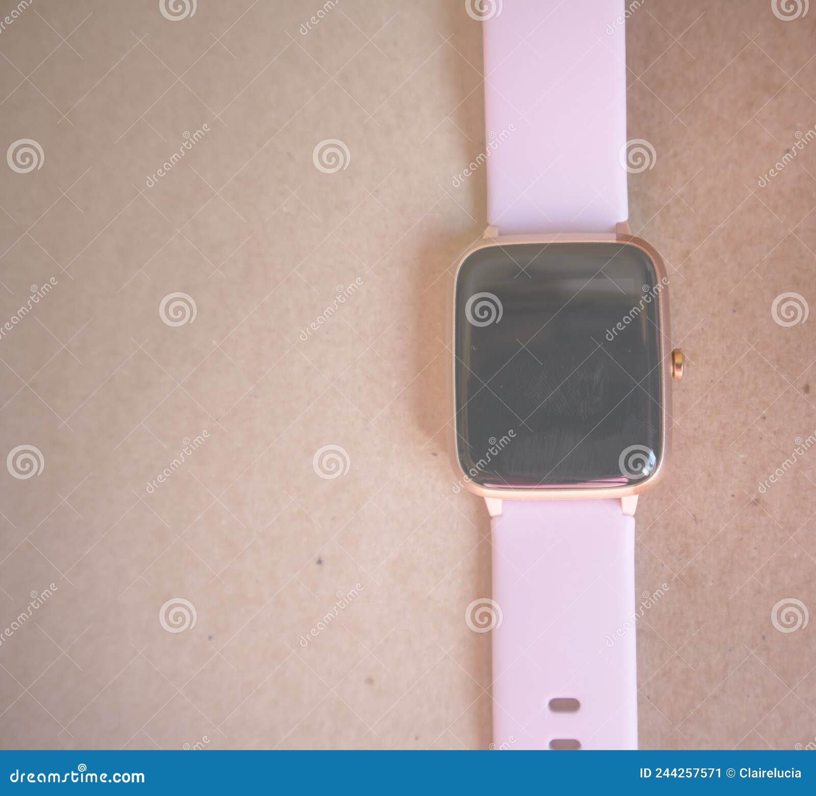 Wireless Smart Watch with Pink Strap Isolated on Brown Kraft Paper ...