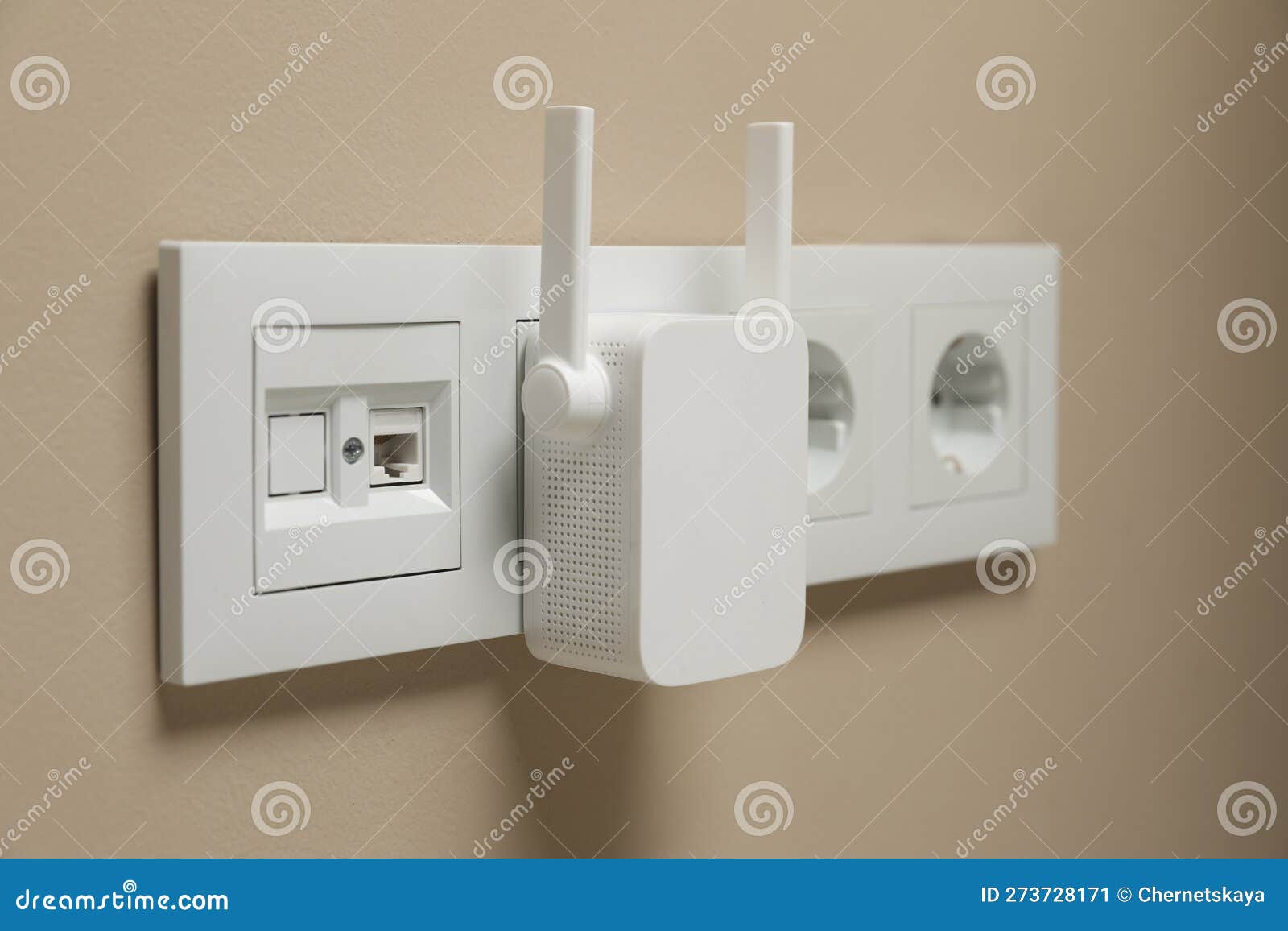 Wireless Wi-Fi Repeater in Power Socket on Beige Wall Stock Image ...