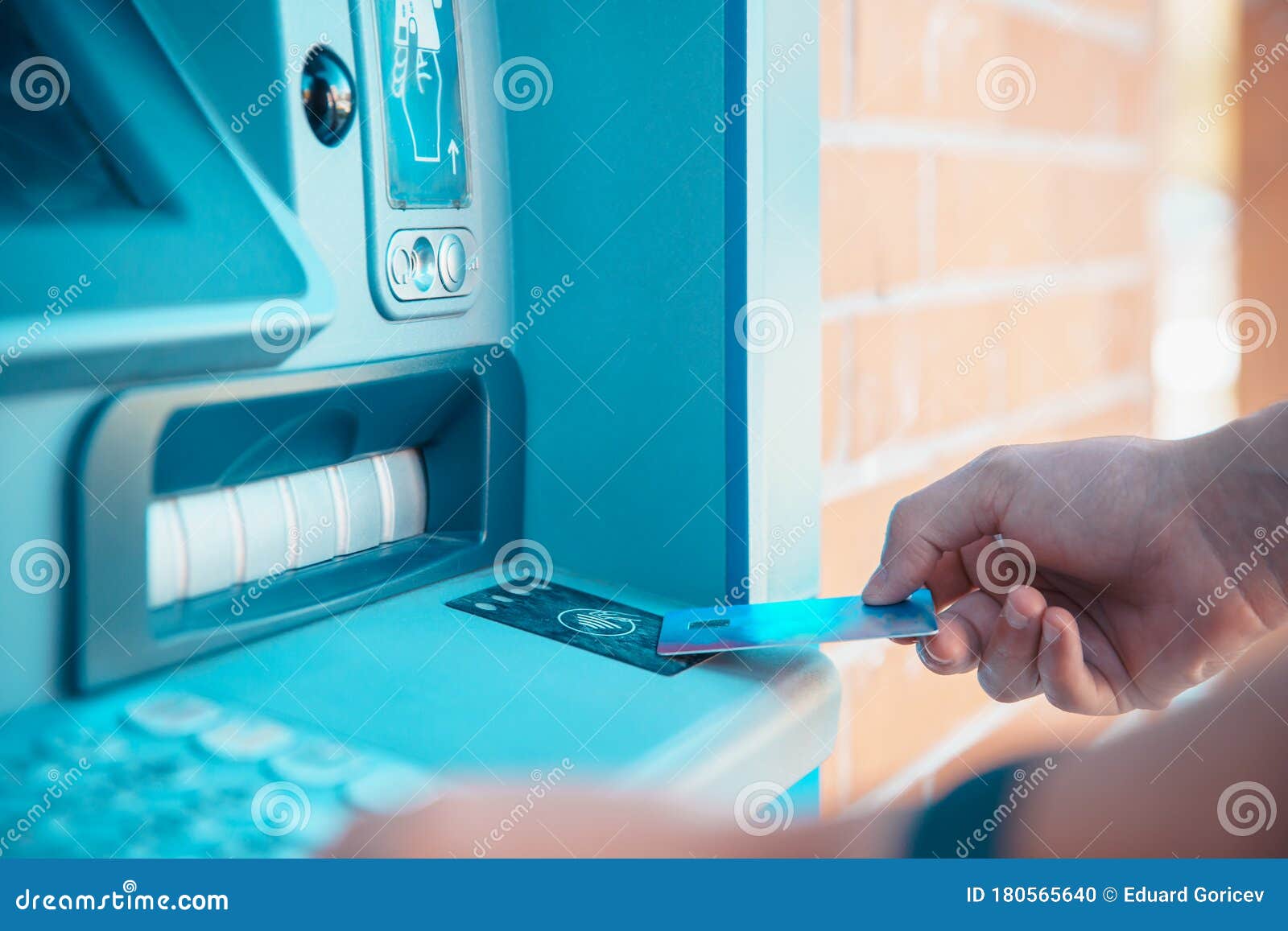 Wireless Withdrawal from an ATM with a Debit Card Stock Photo - Image ...