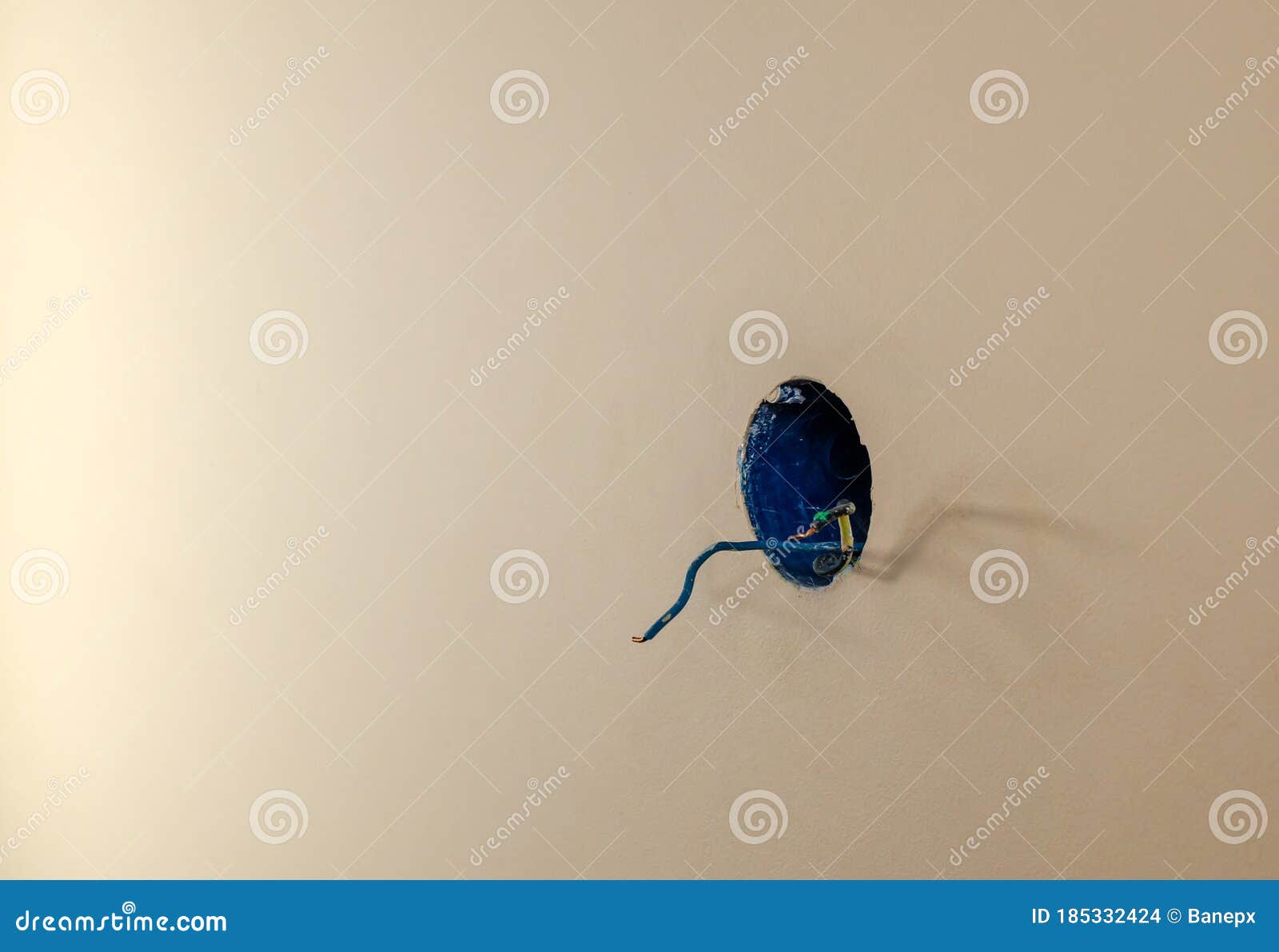 Wires protrude from a wall stock photo. Image of electric - 185332424