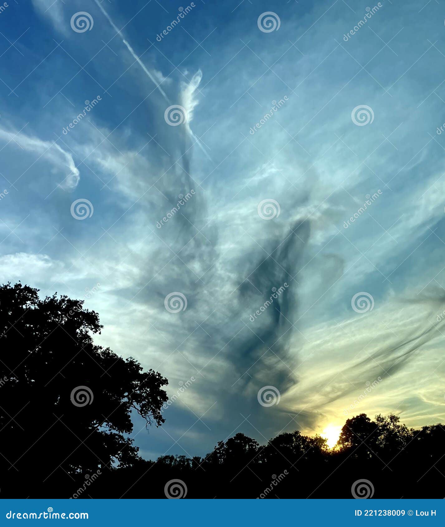 Wispy clouds at sunset stock image. Image of clouds - 221238009