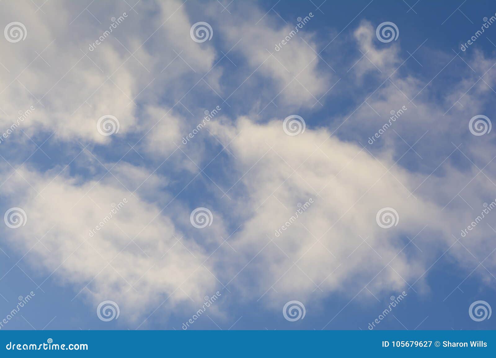 Wispy White Clouds Against a Blue Sky. Background Suitable Stock Image ...