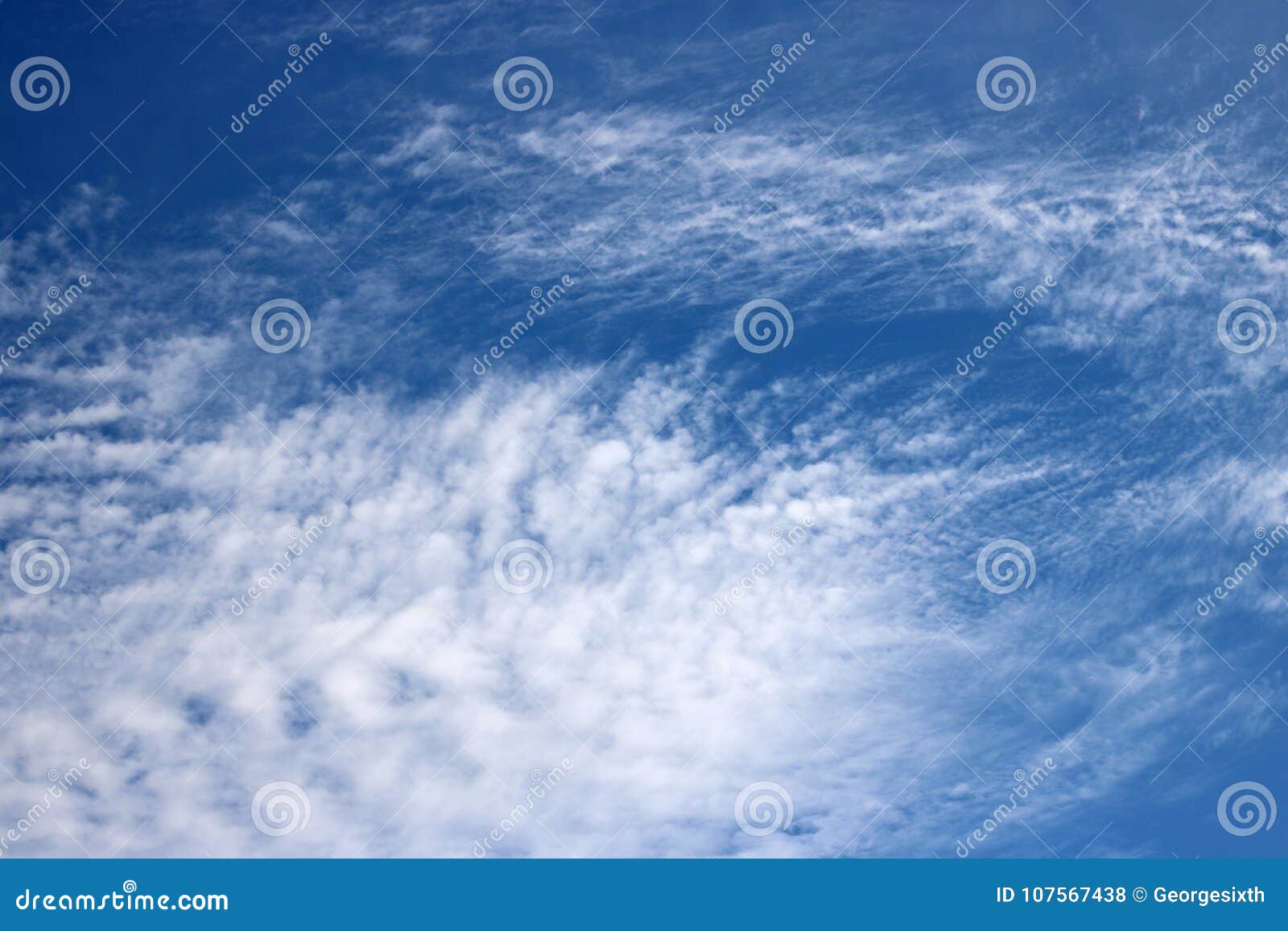 Wispy White Clouds Against Blue Sky on Sunny Day Stock Photo - Image of ...