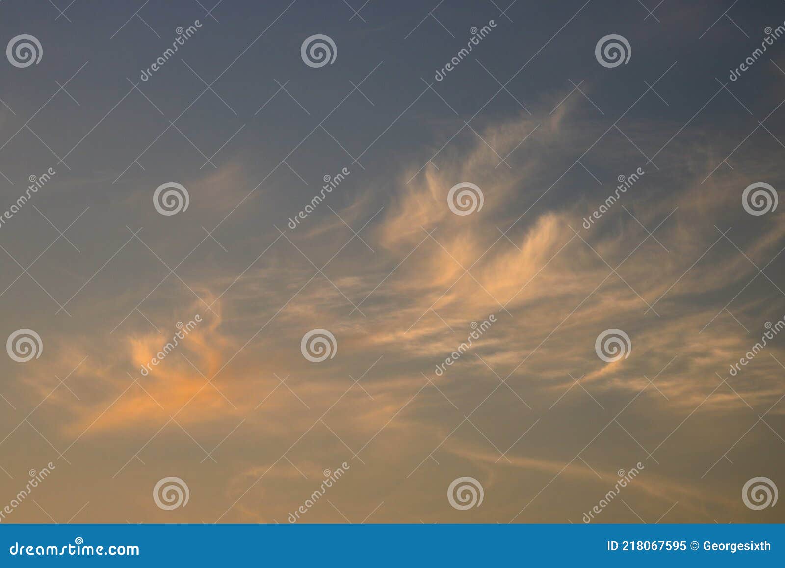 Wispy White Clouds Colored by the Setting Sun Stock Image - Image of ...