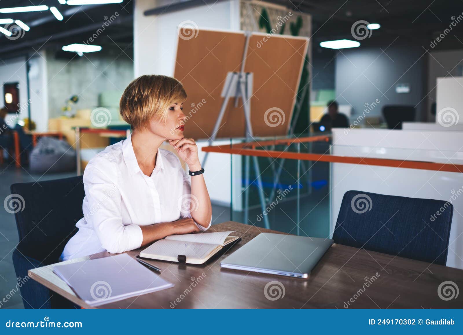 Thoughtful Woman Working on Project in Office Stock Photo - Image of ...