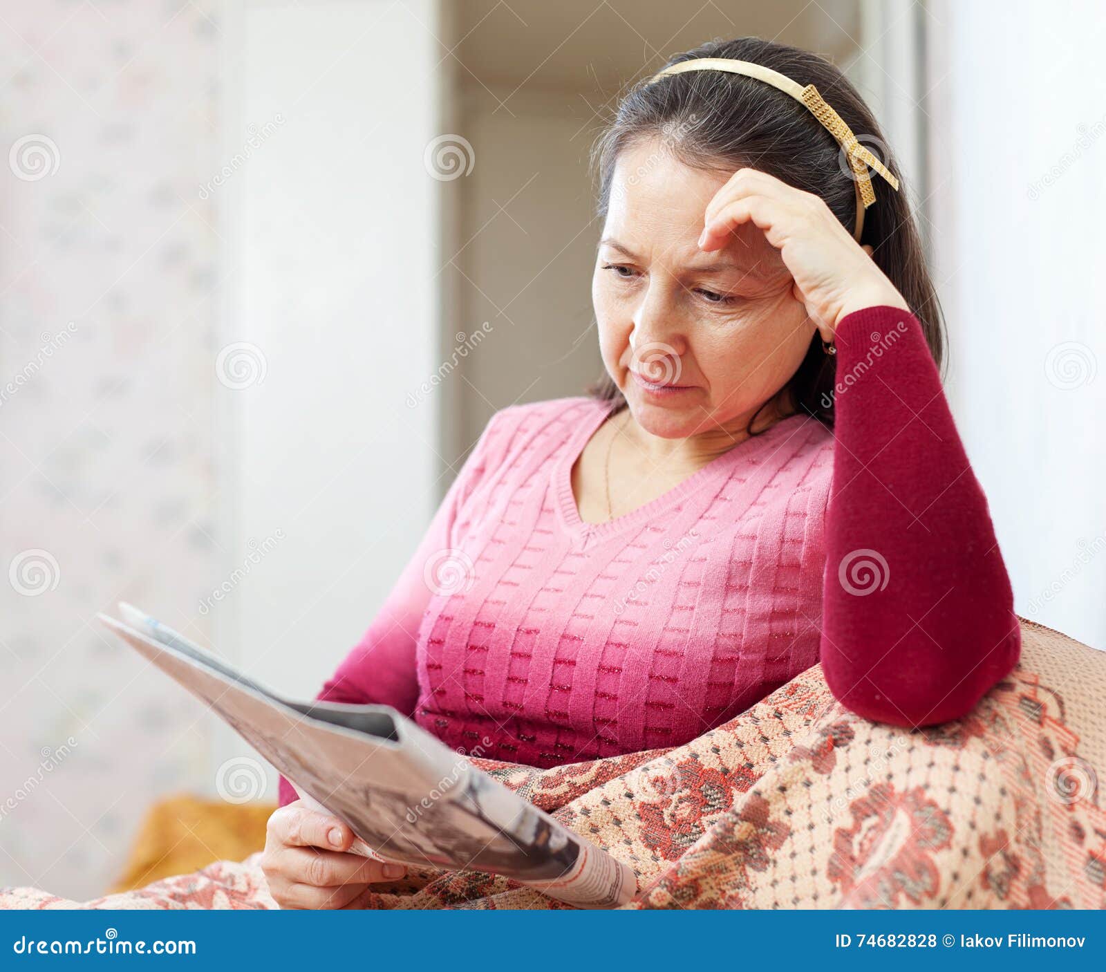 Wistful Woman Reading Newspaper Stock Photo - Image of people, casual ...