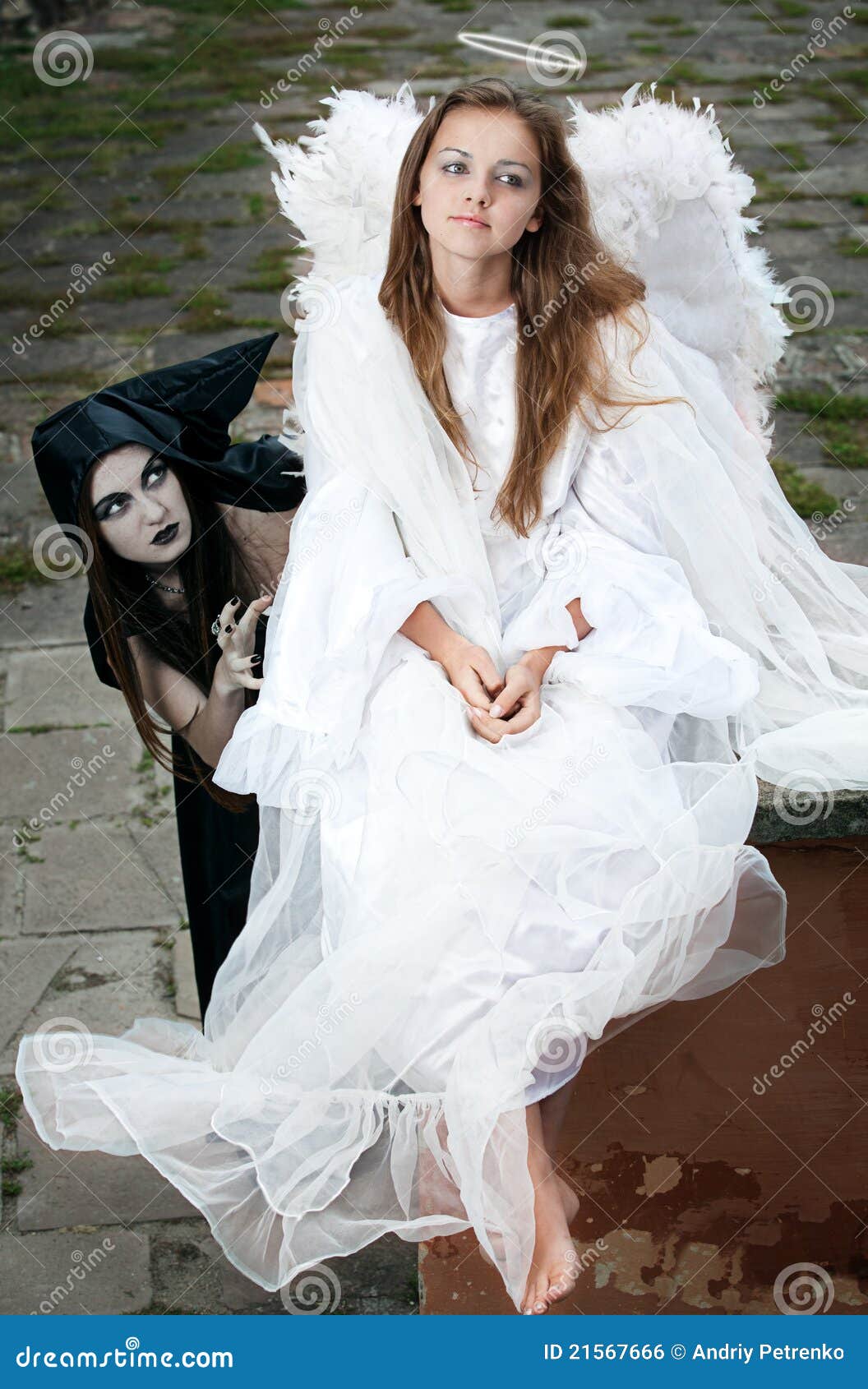Witch and Angel Against the Walls Stock Photo - Image of calm, cruel ...