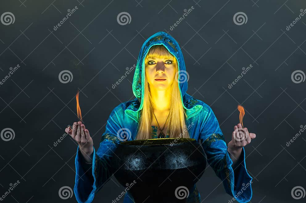 Witch with fire in hands stock image. Image of blond - 36694147