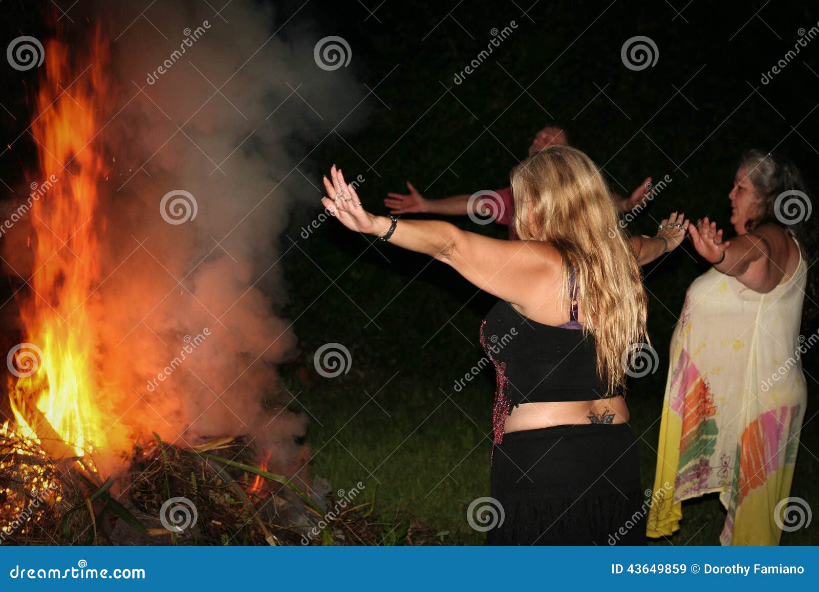 African People Dancing Around Fire