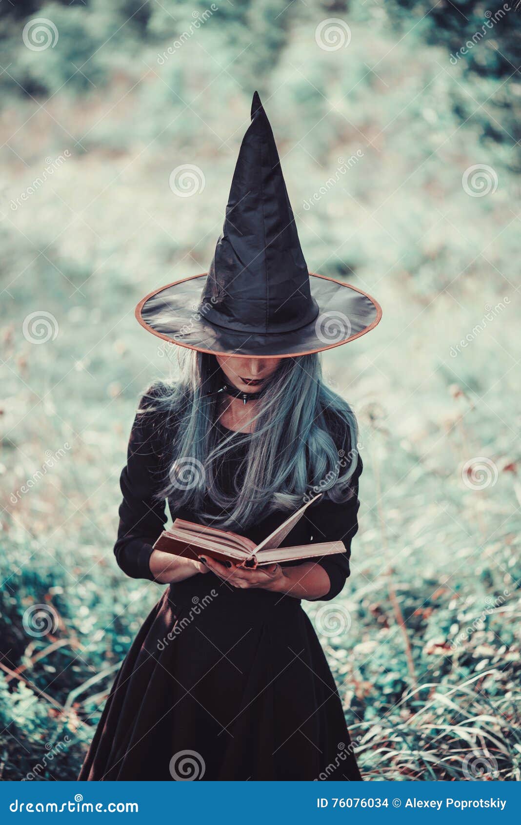 Witch reading a book stock photo. Image of evil, woman - 76076034