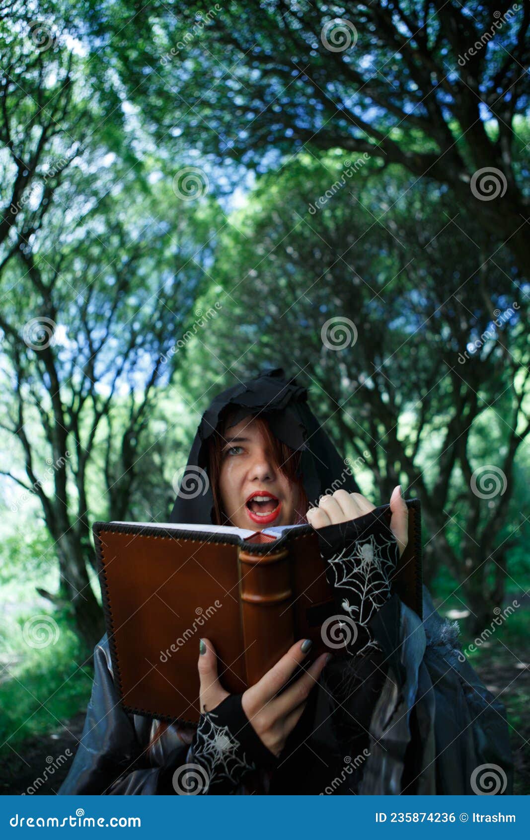 Witch Reading Spell from Book Stock Photo - Image of mystical, long ...