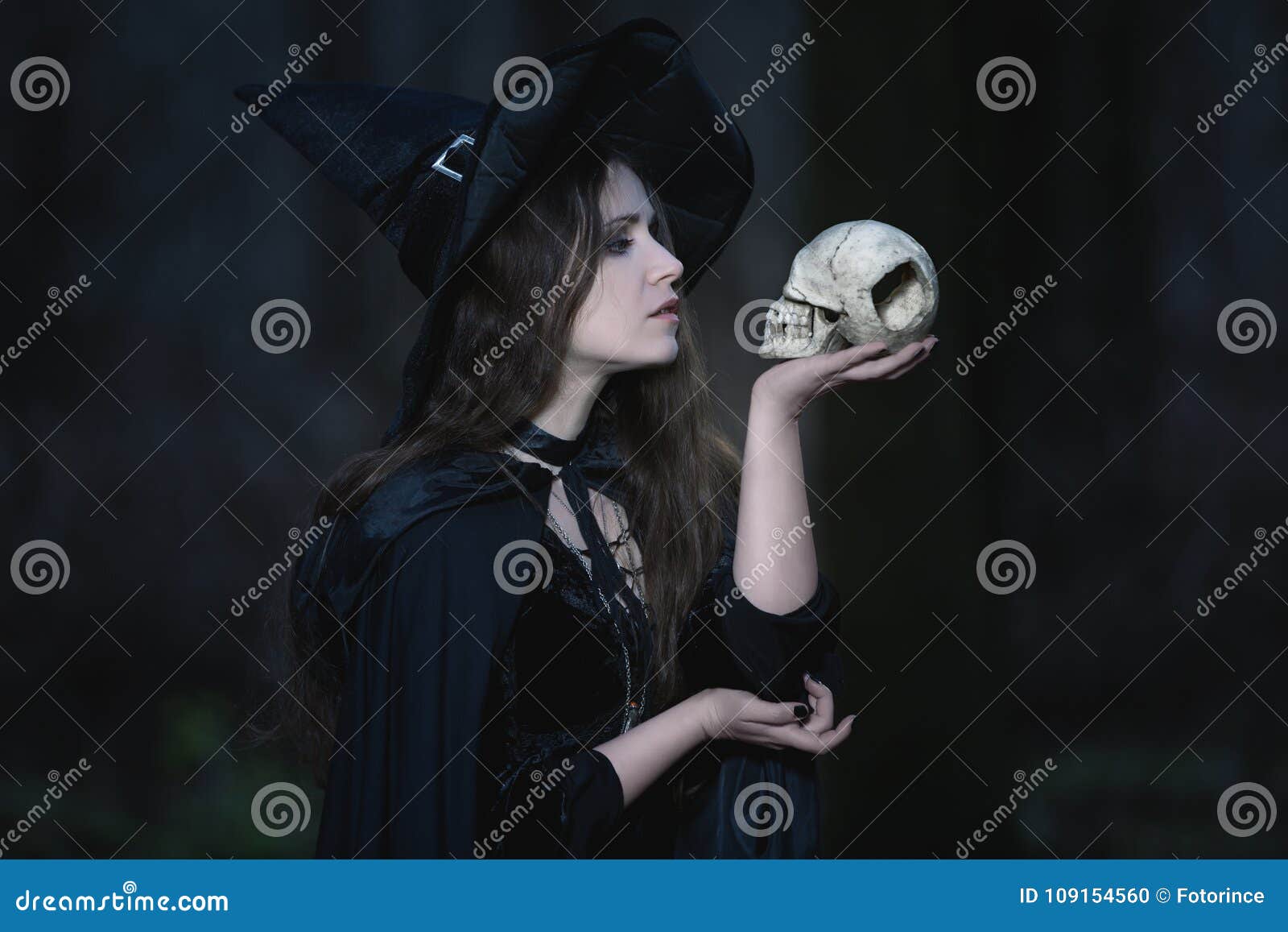 Witch with a skull stock photo. Image of mystery, girl - 109154560