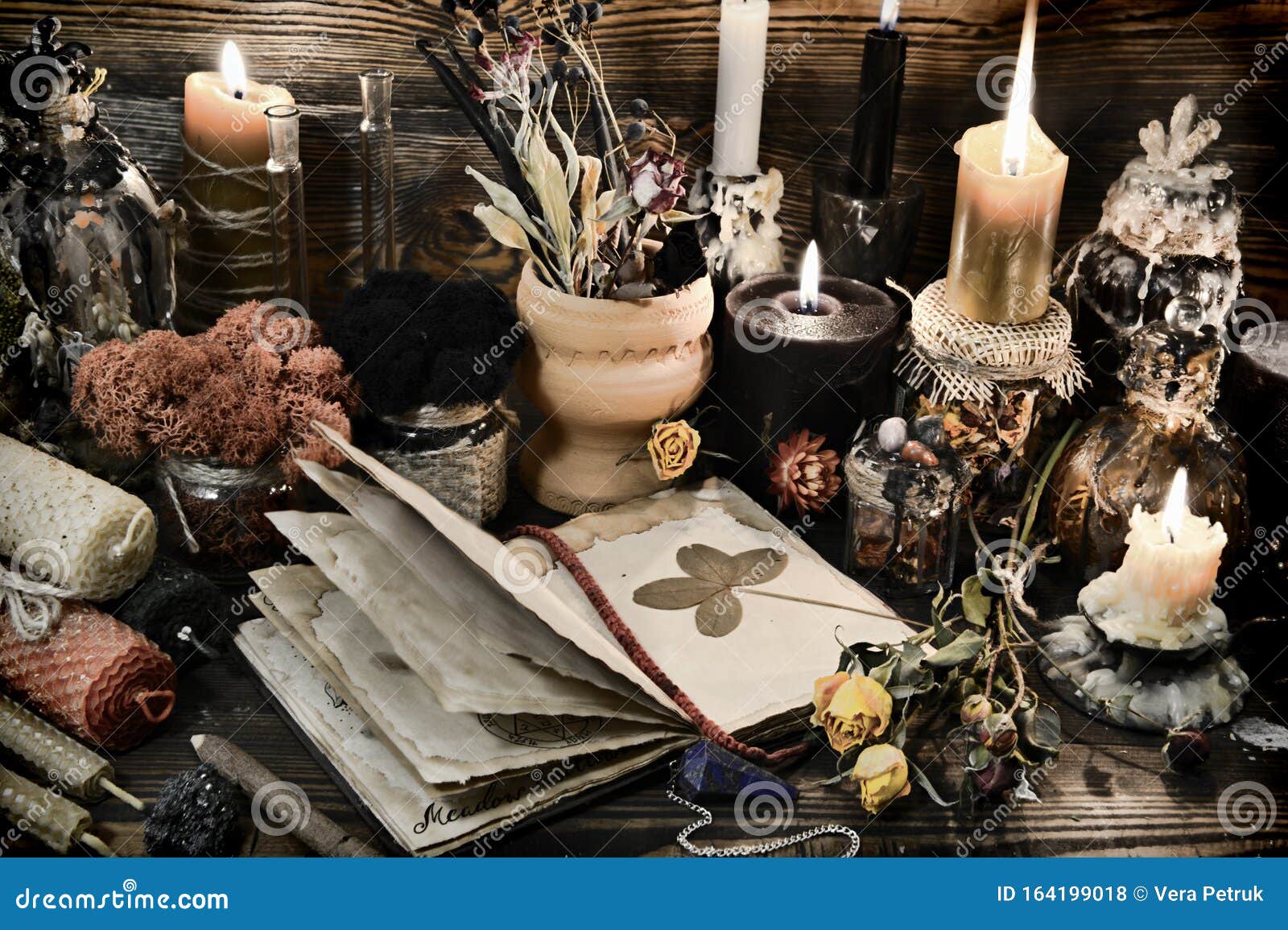 Witch Table with Magic Objects, Four-leaf Clover, Candles and Open ...