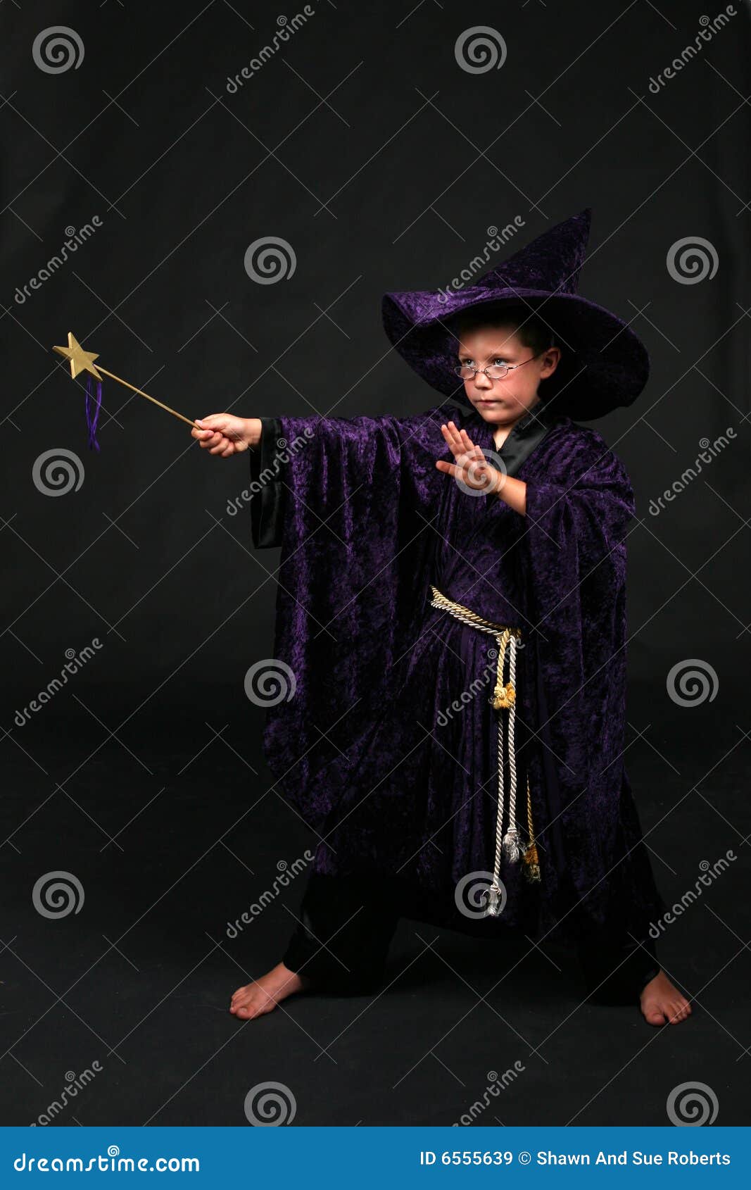 Wizard Boy with Magic Wand Casting a Spell Stock Image - Image of ...