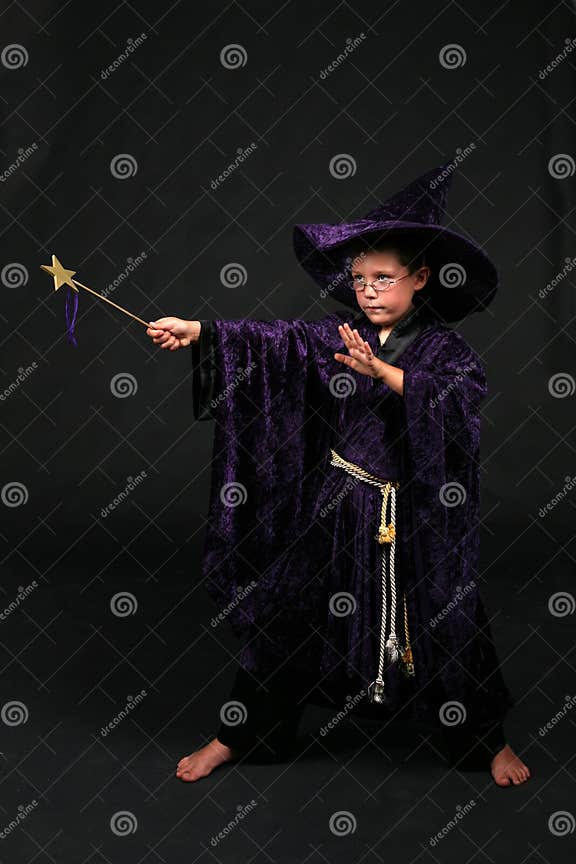 Wizard Boy with Magic Wand Casting a Spell Stock Image - Image of ...