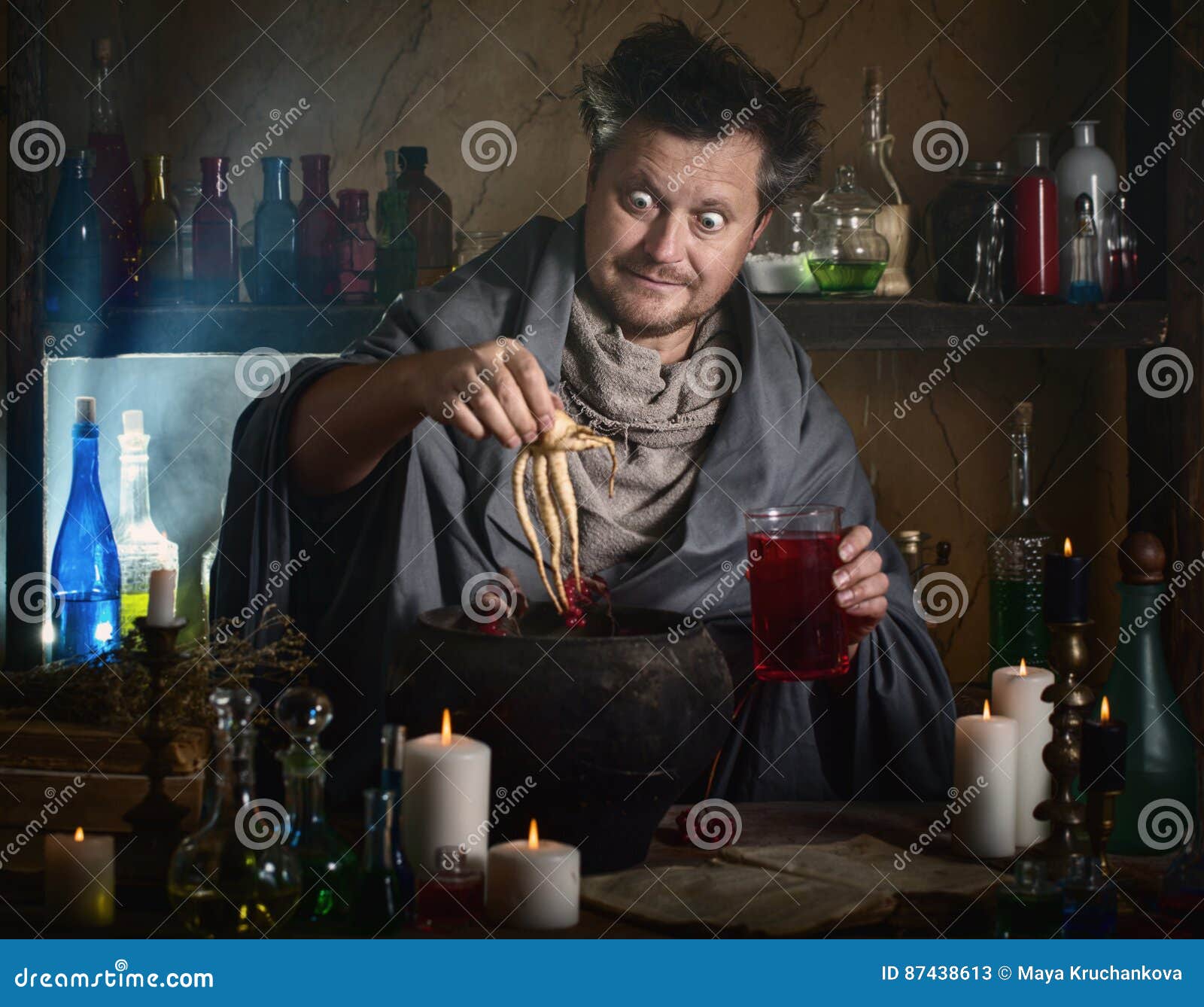 Wizard brews a potion stock image. Image of mandrake - 87438613