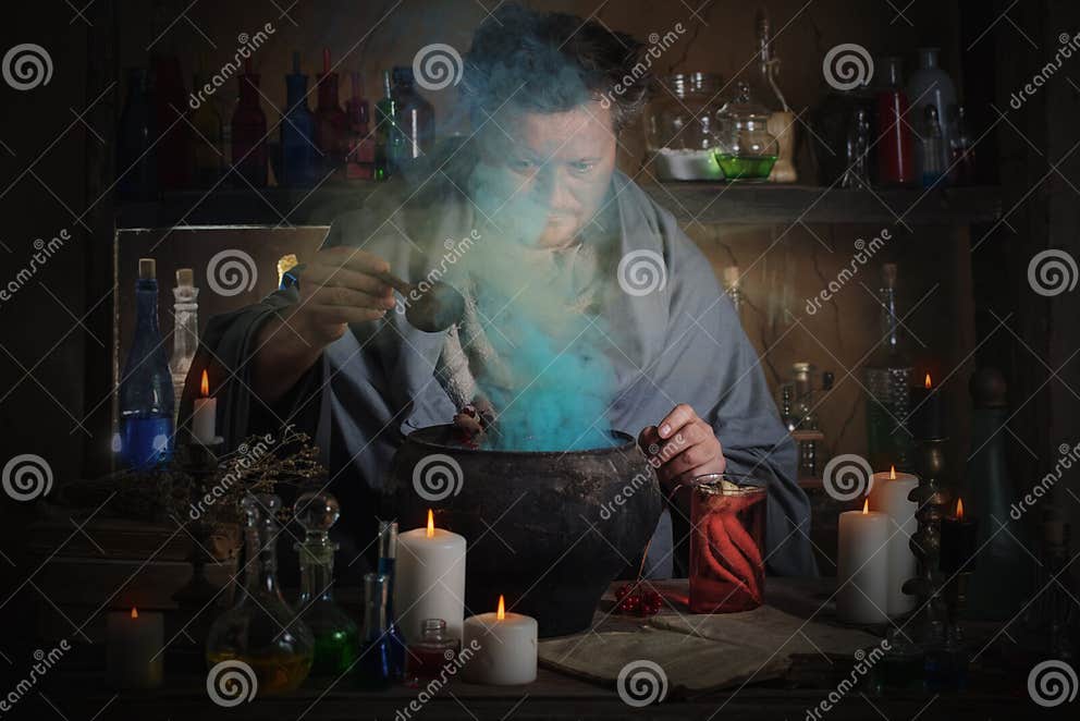 Wizard brews a potion stock image. Image of manuscripts - 84101313