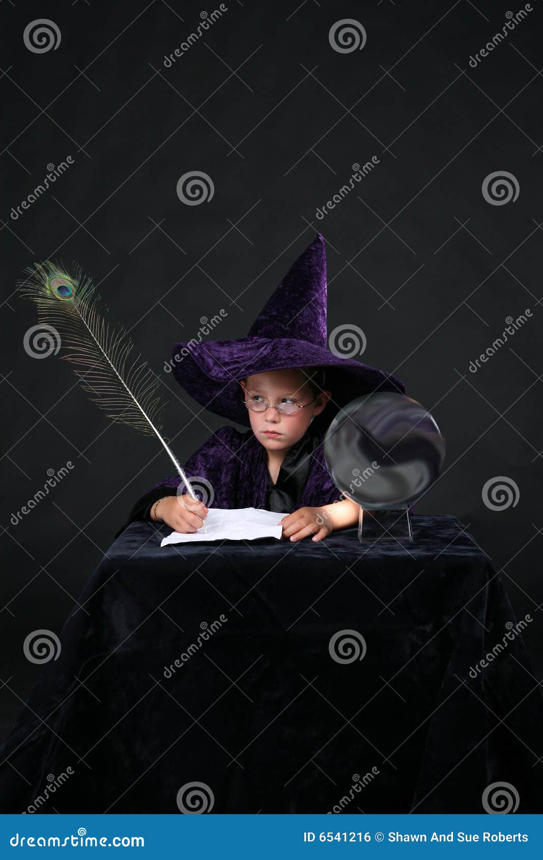 Wizard Child with Peacock Feather Pen Stock Photo - Image of feather ...