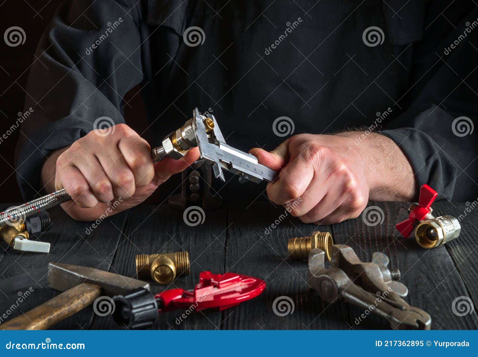 Wizard or Master Measures the Size of Fitting Using a Caliper before ...