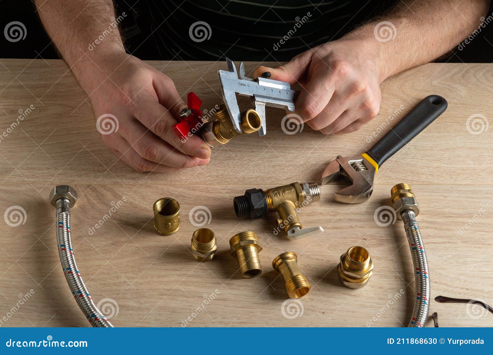 Wizard Or Master Measures The Size Of Fitting Using A Caliper Before ...