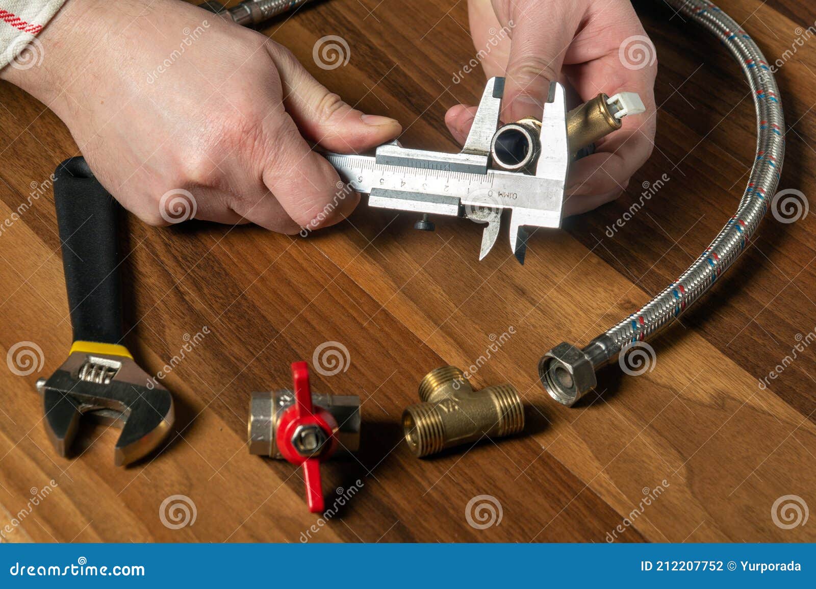 The Wizard Measures the Size of Fitting Using a Caliper before ...