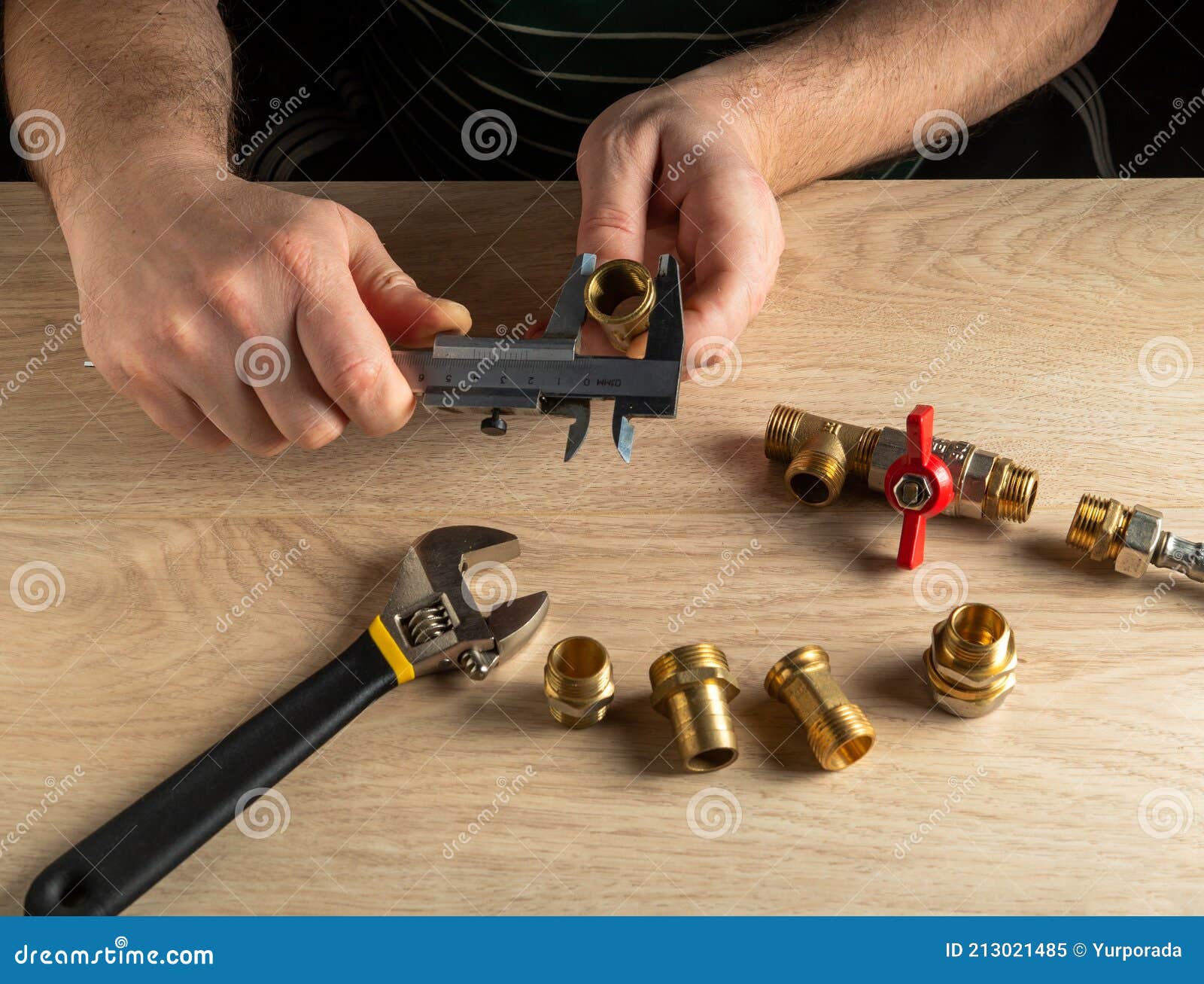 The Wizard Measures the Size of Fitting Using a Caliper before ...