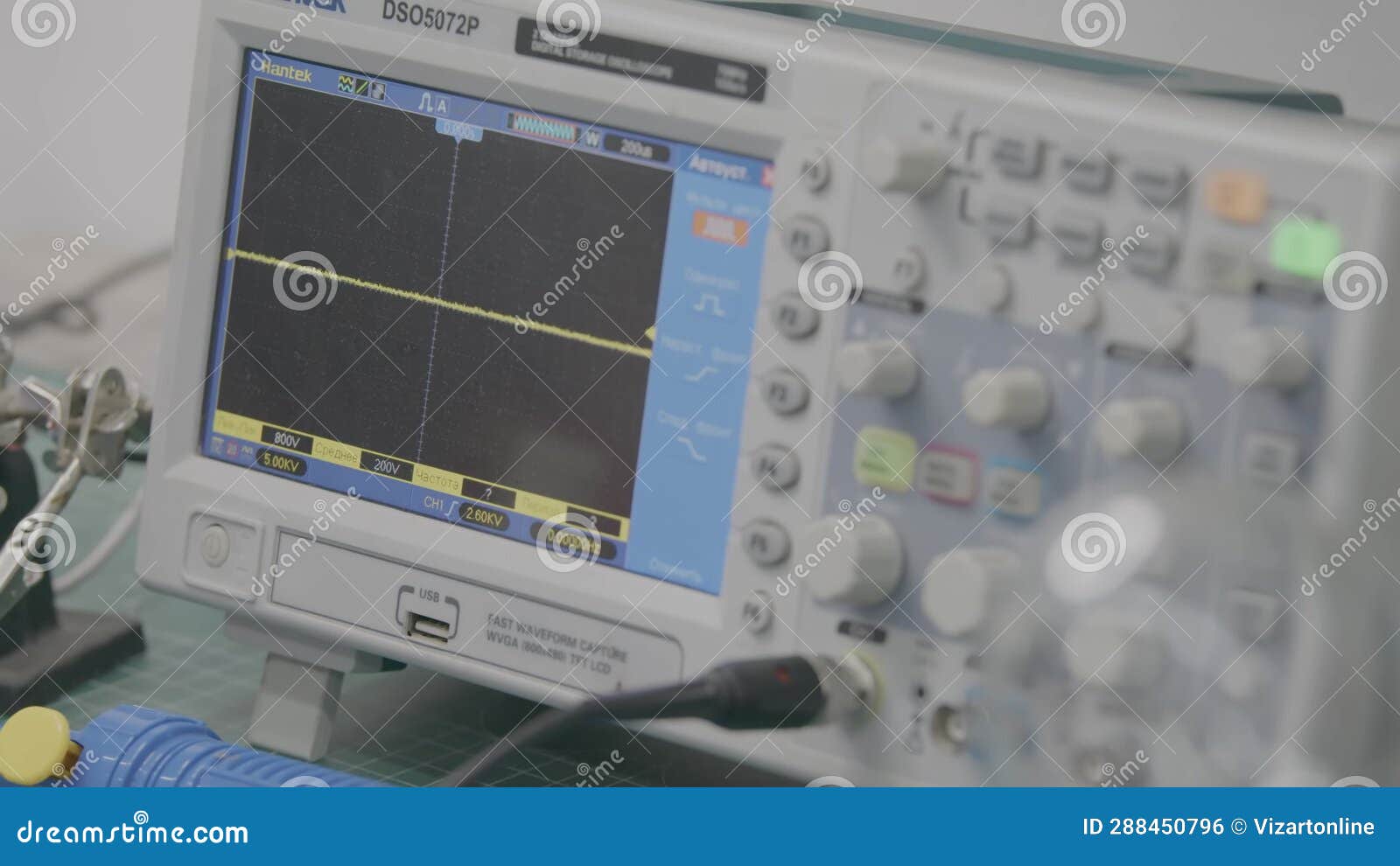 The Wizard Tests Electronic Components Using an Oscilloscope Stock ...