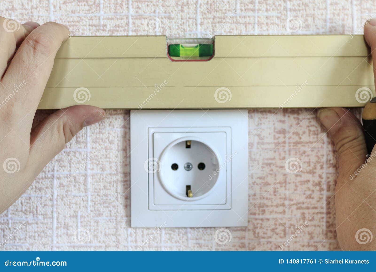 . the Wizard Using the Level Set the Outlet. he is White. Close-up ...