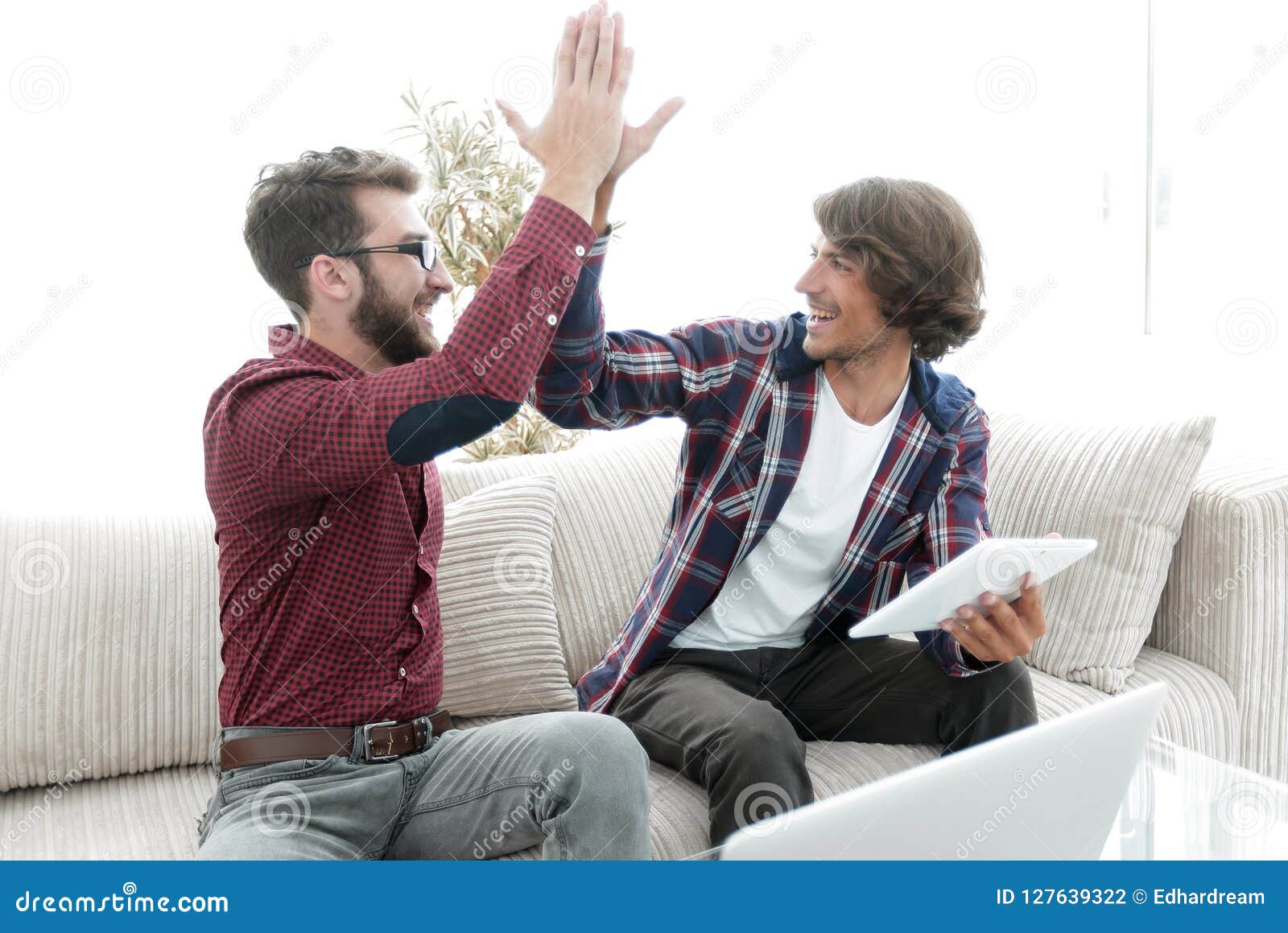 Wo Guys Sitting on the Couch and Giving Each Other Five Stock Photo ...