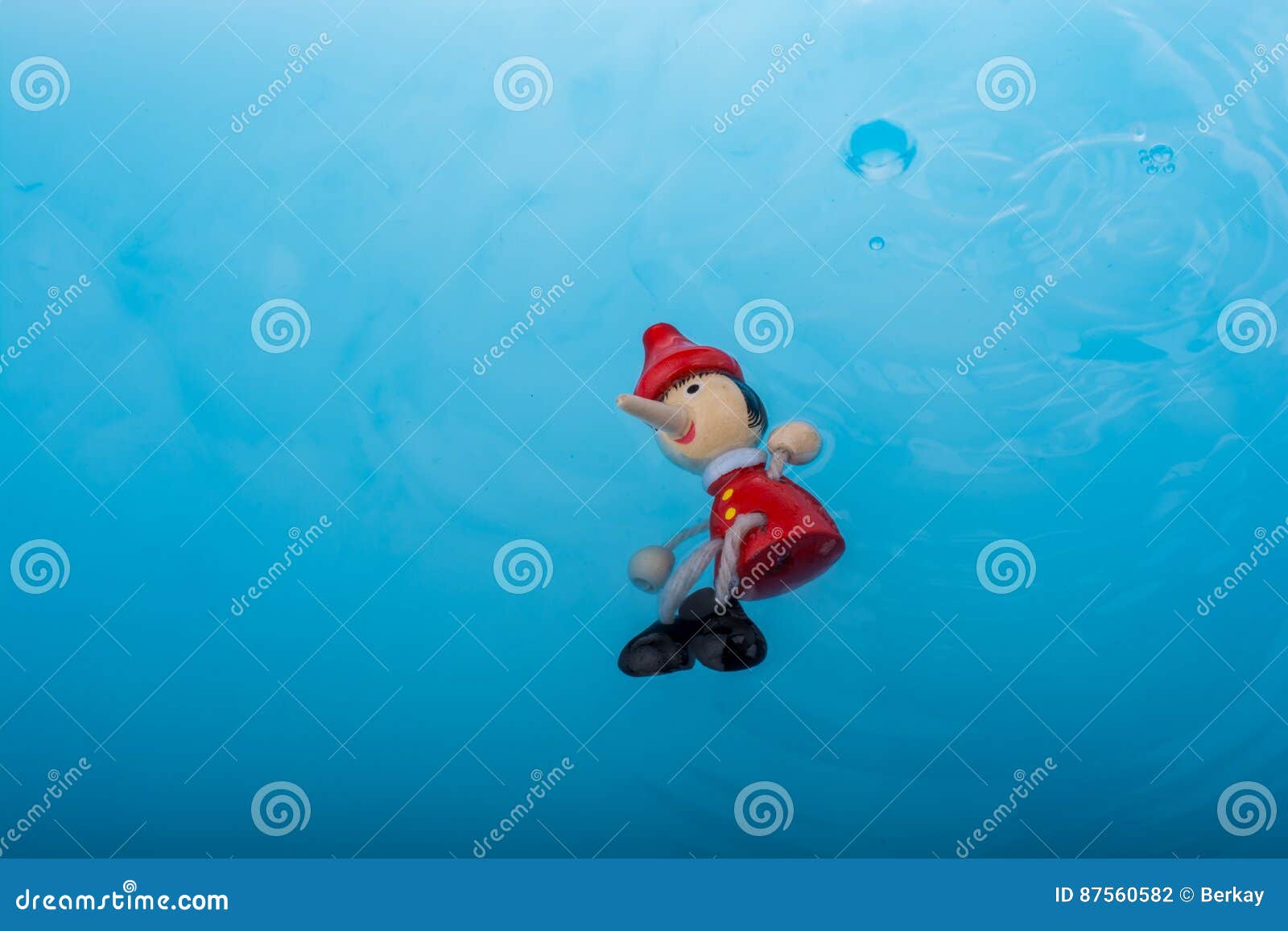 Wodden Puppet Pinocchio in Water Stock Photo - Image of lying, save ...