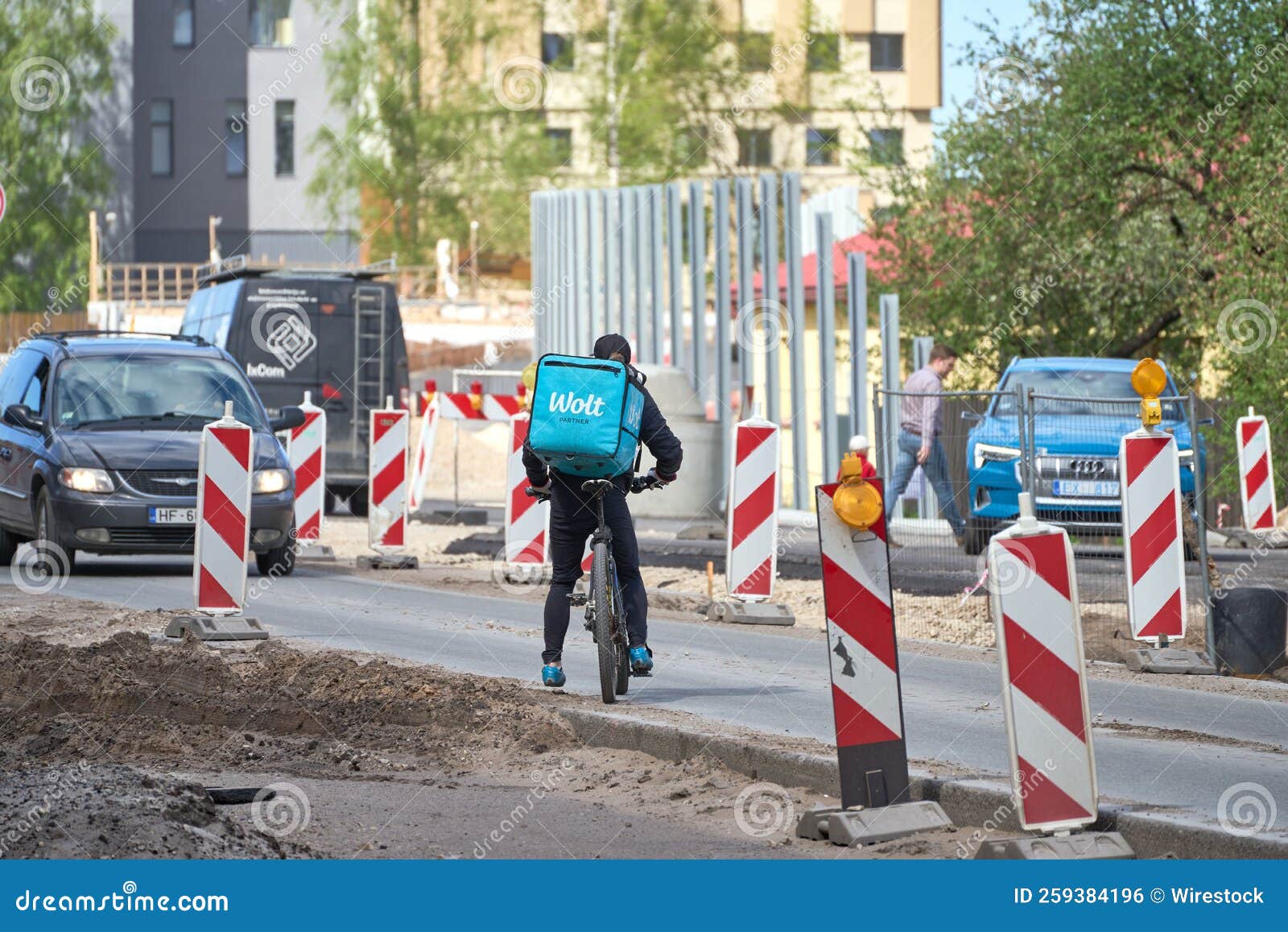 Wolt Food Delivery Man on a Bicycle on a Road Undergoing Reconstruction ...